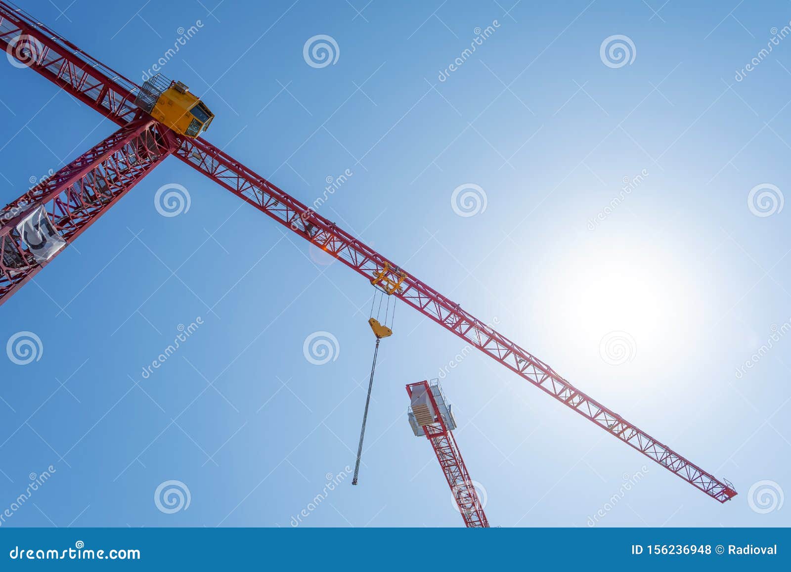 Tower Crane on the Background of Blue Sunny Sky. Bottom View ...