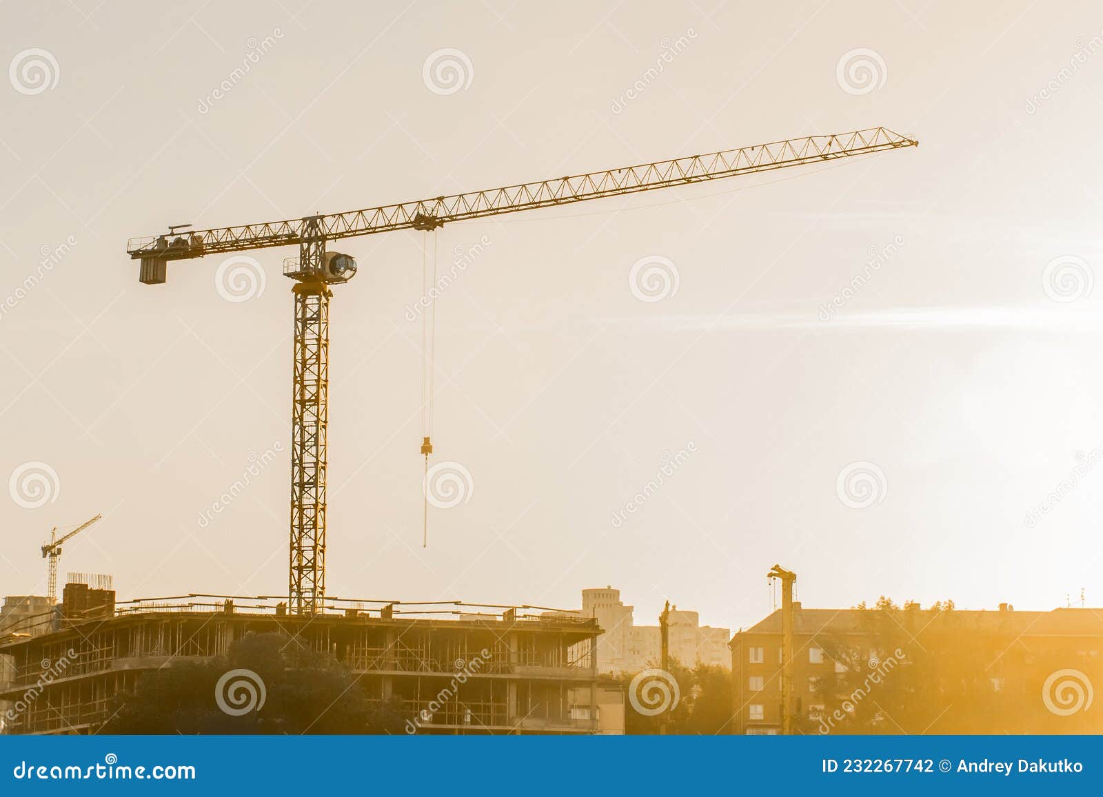 Tower Crane on the Construction Site Against the Backdrop of Sunset ...