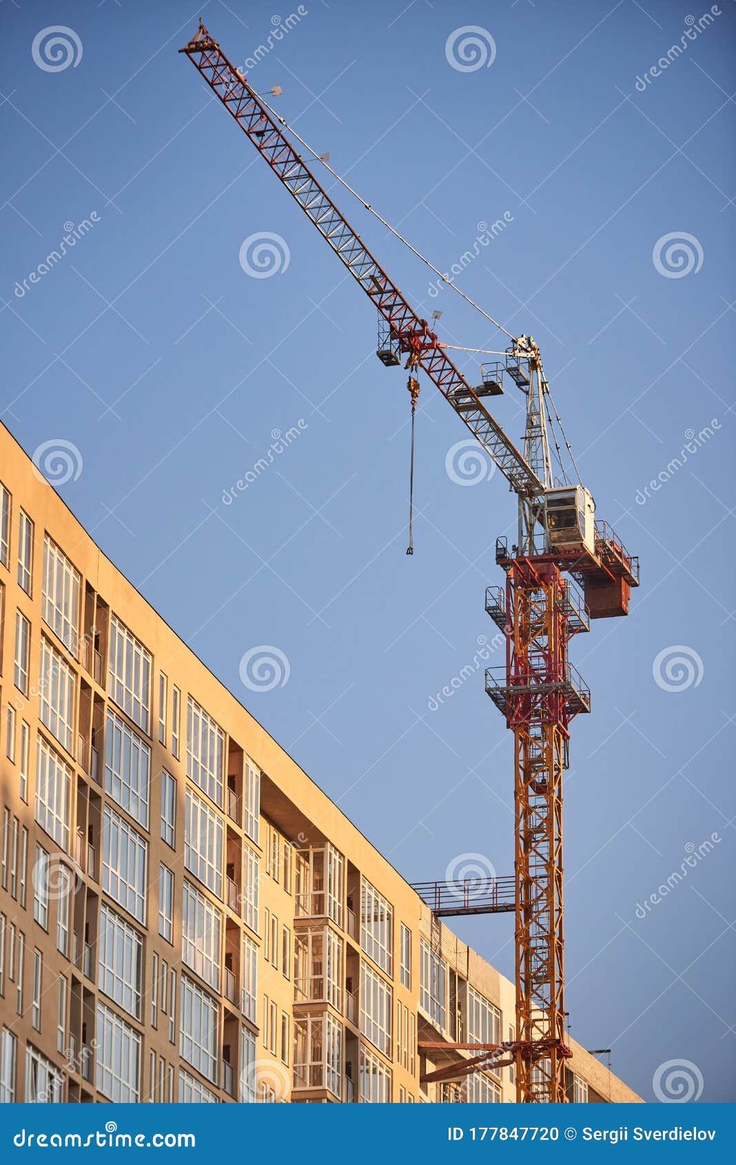 Tower Crane on the Construction Site with City Building Background at ...