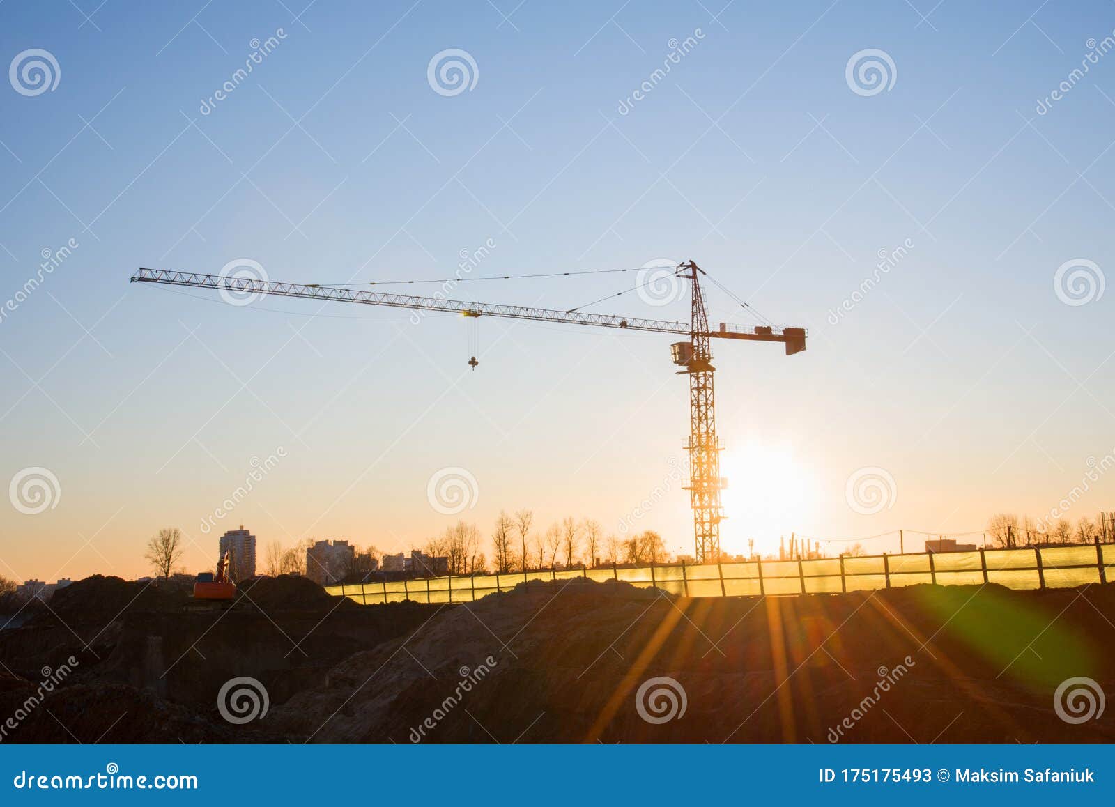 Tower Crane at Construction Site on Sunset Background. Construction ...