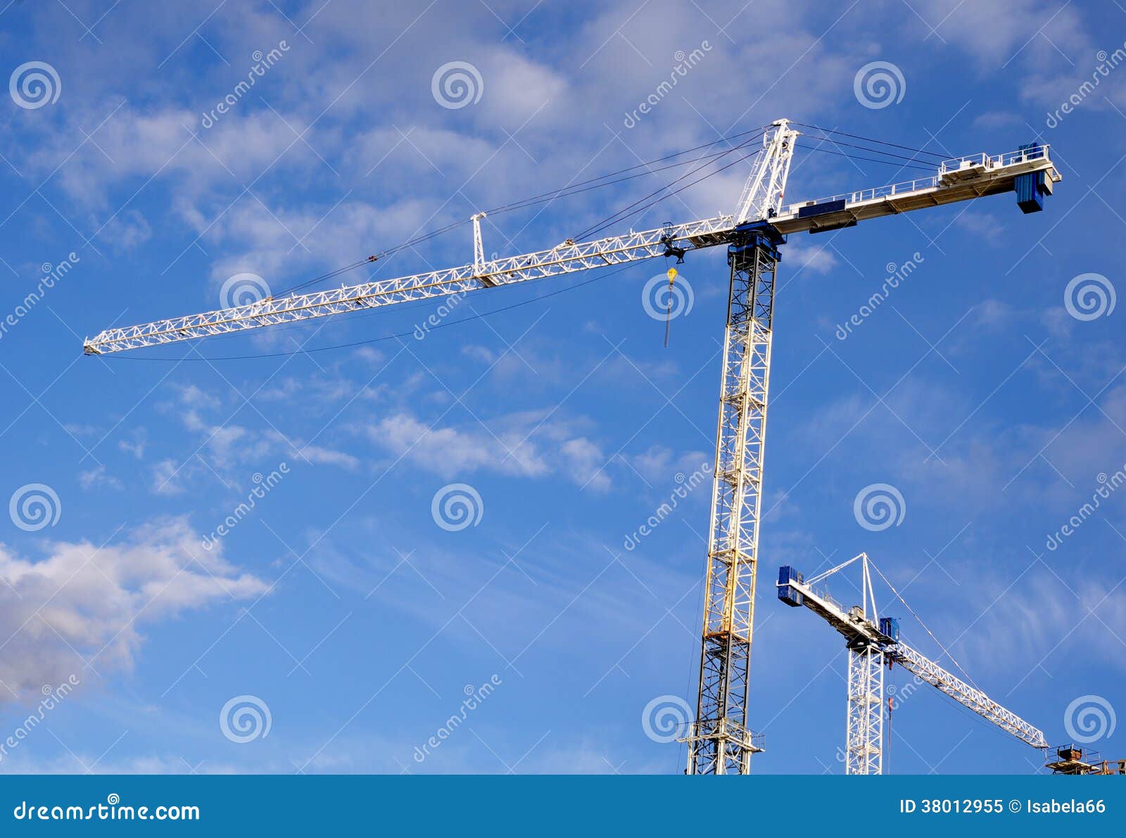 Tower Crane Hoisting Load in a Sunny Day Stock Image - Image of cable ...