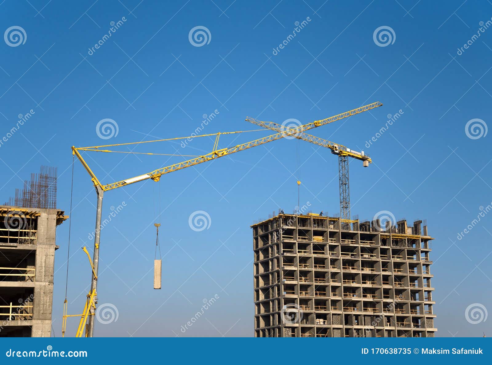 Tower Cranes Constructing a New Residential Building at a Construction ...