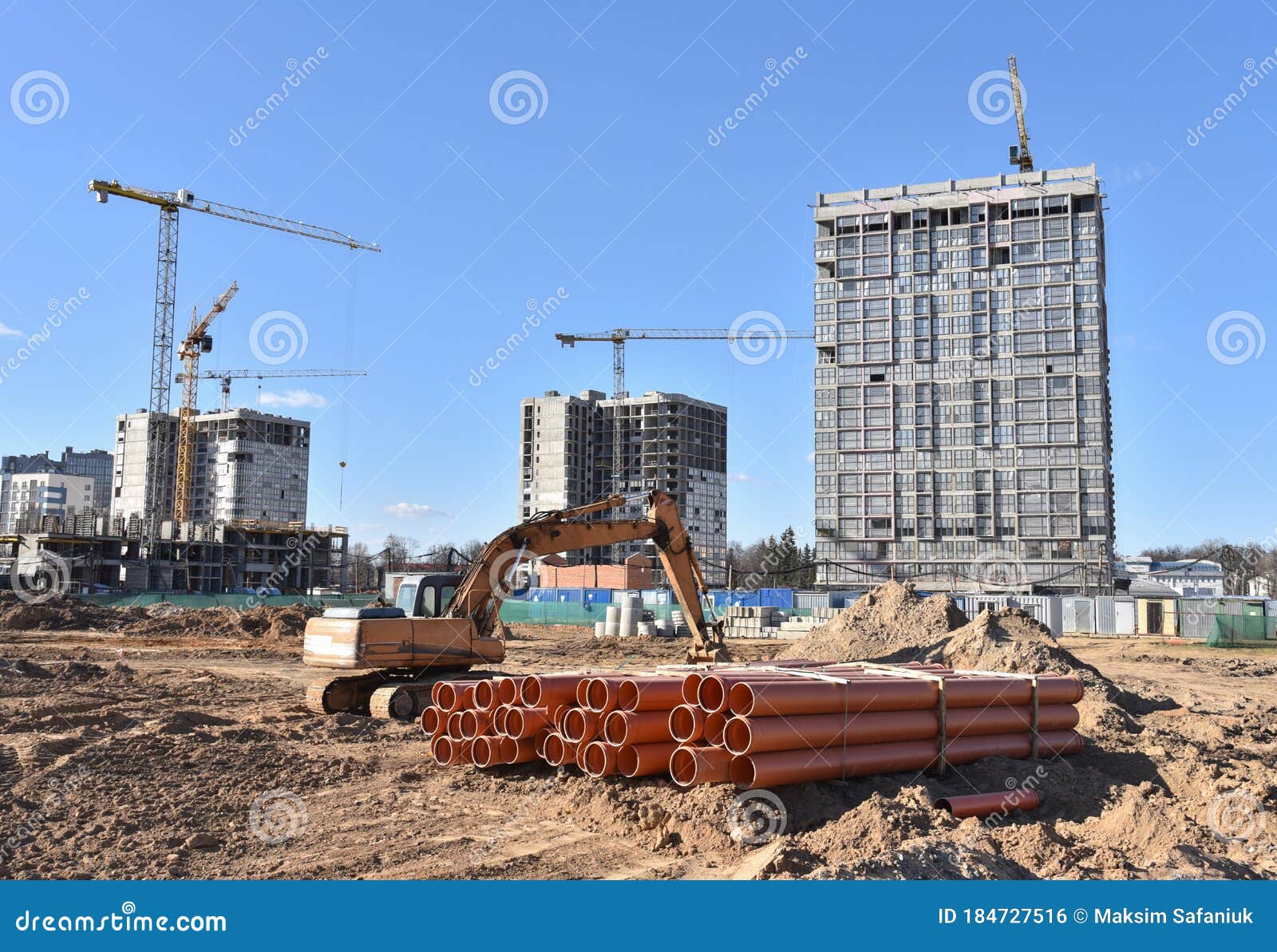 Tower Cranes Constructing Residential Buildings. Excavator on ...