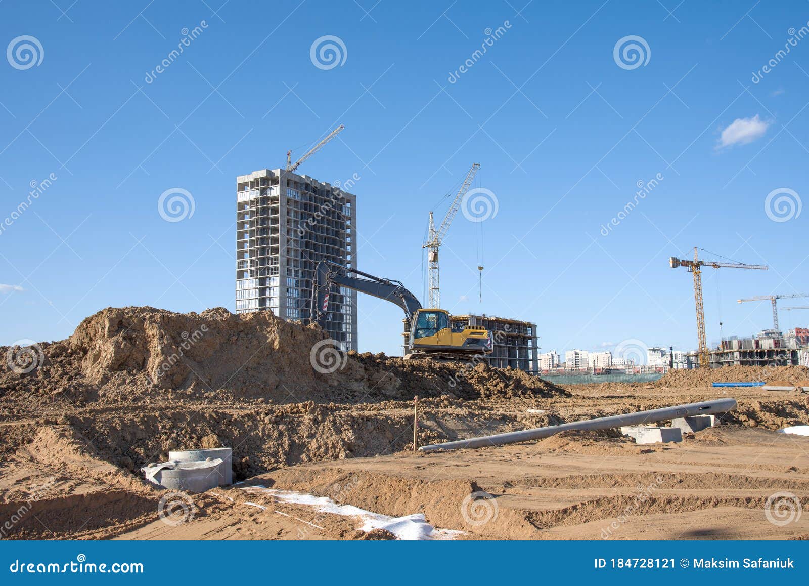 Tower Cranes Constructing Residential Buildings. Excavator on ...