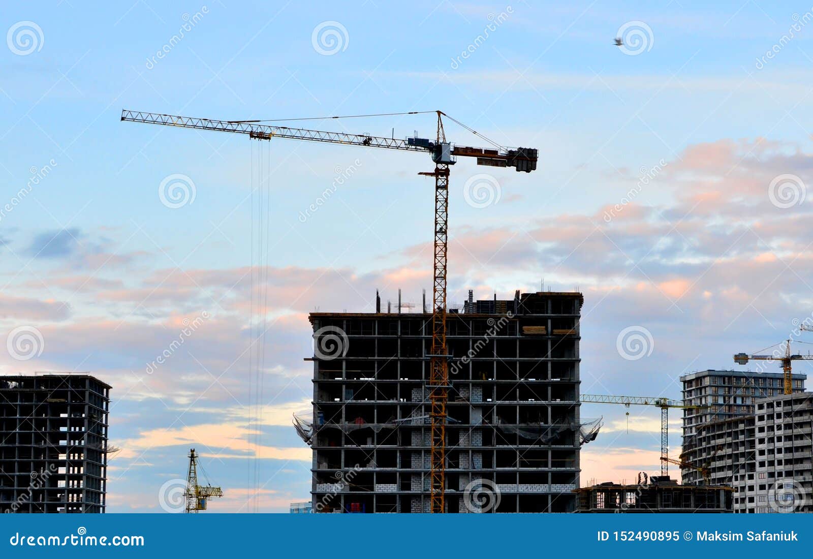 Tower Cranes at Construction Site in the Sunset Sky Stock Image - Image ...