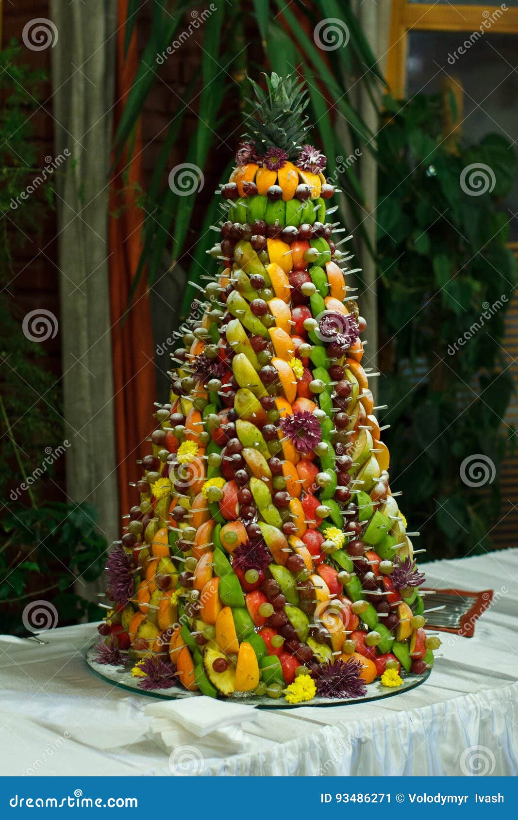 A Tower of Exotic Fruits Stands on a White Table Stock Image - Image of ...