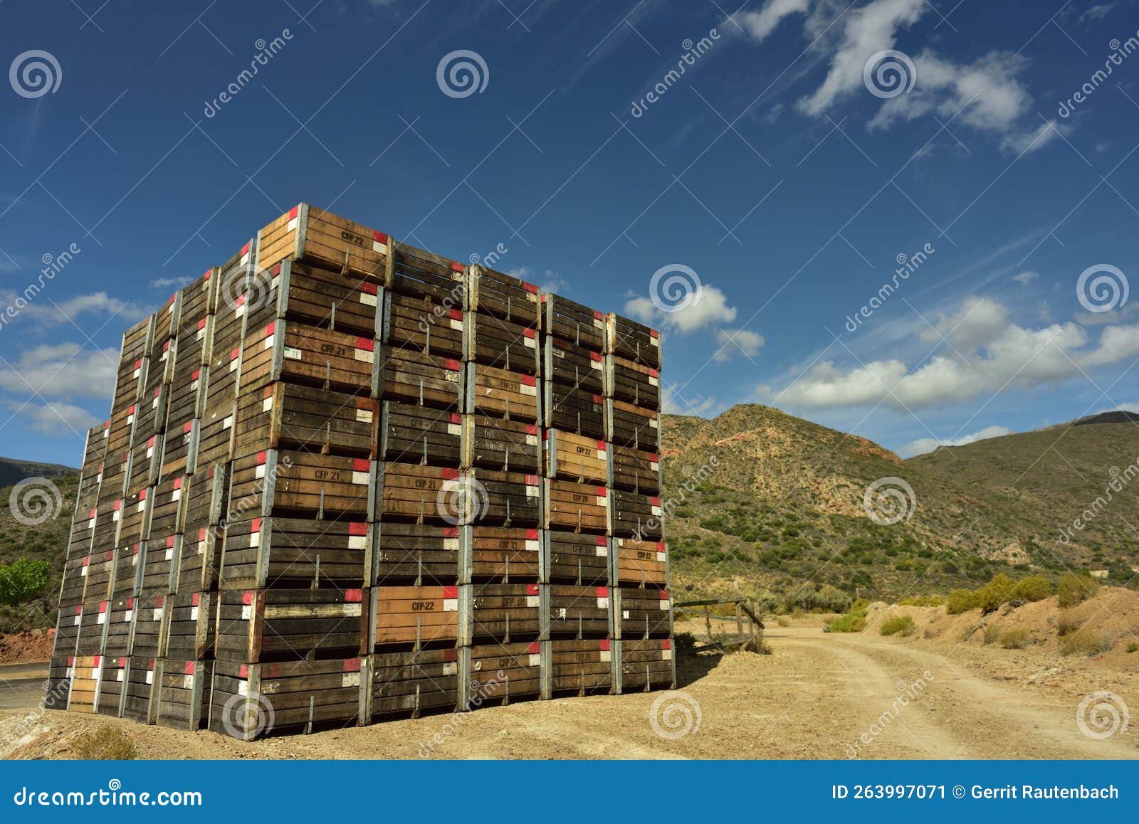 A Tower of Fruit Crates Stacked on an Open Field Stock Image - Image of ...