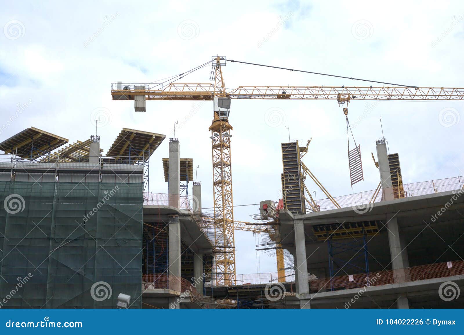 Tower Hoisting Crane Elevate Panels at Construction Process on Top of ...