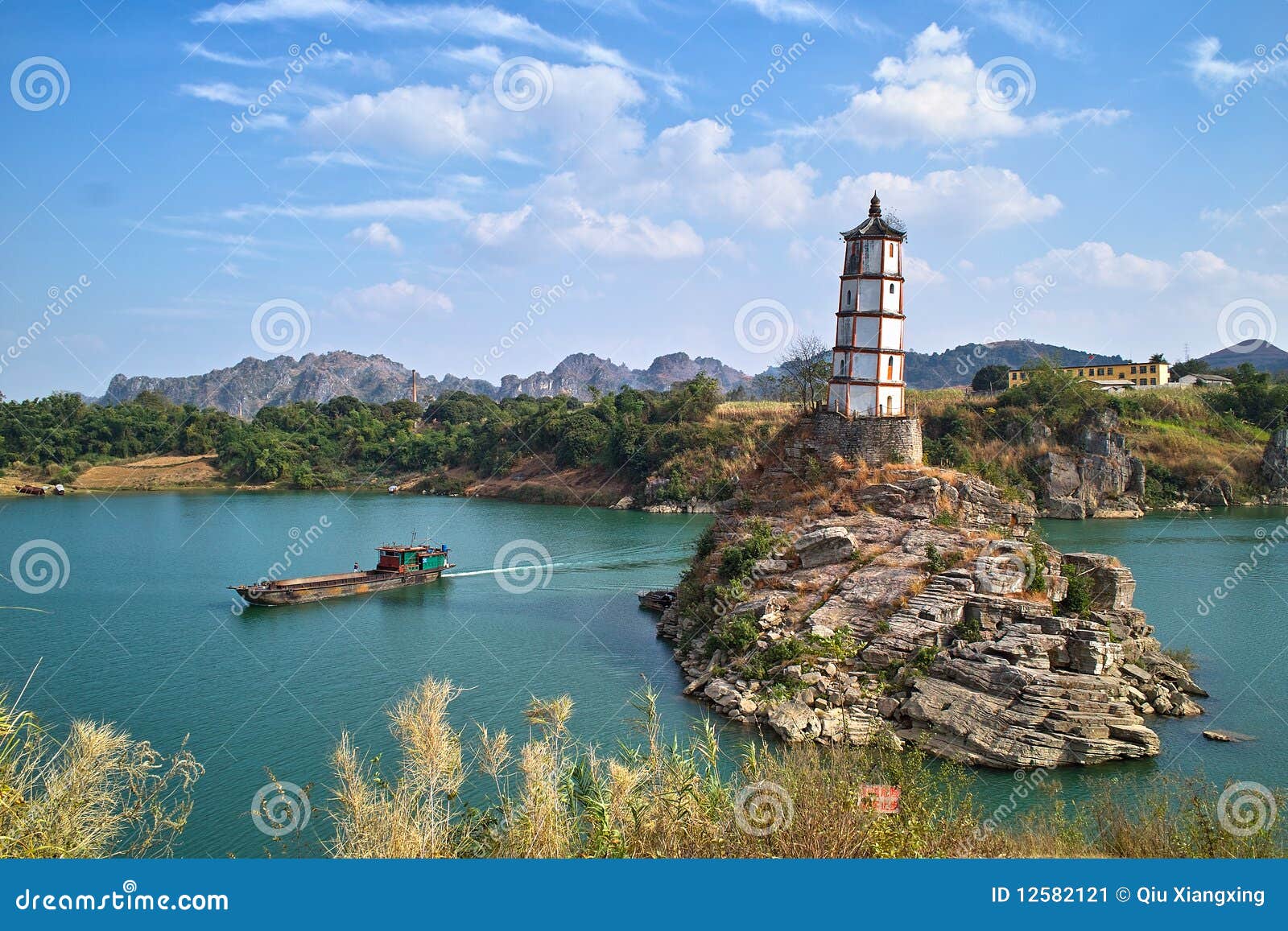 Tower on island in ocean stock image. Image of cloudscape - 12582121