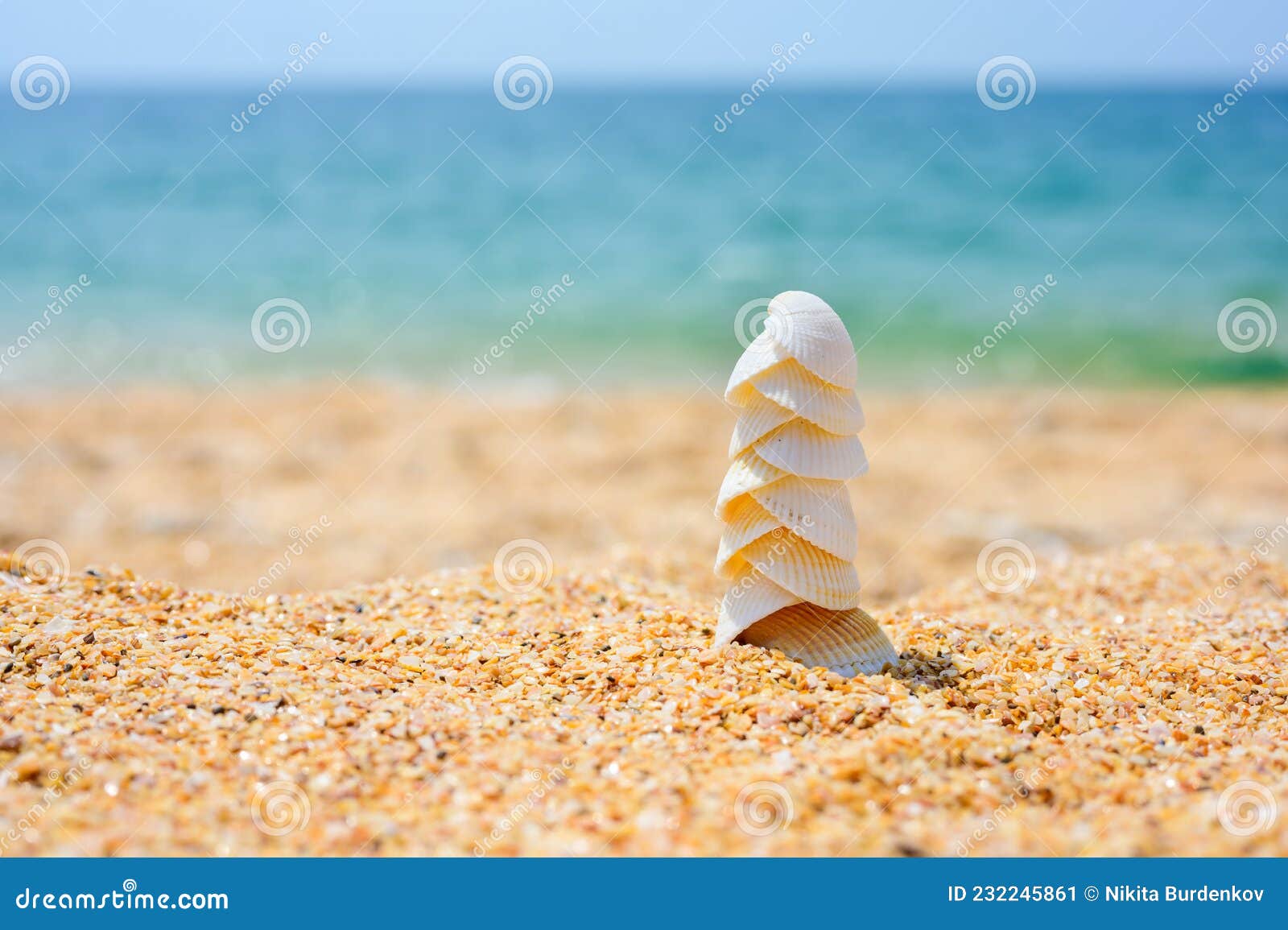 A Tower Made of White Shells on the Seashore. Stock Image - Image of ...