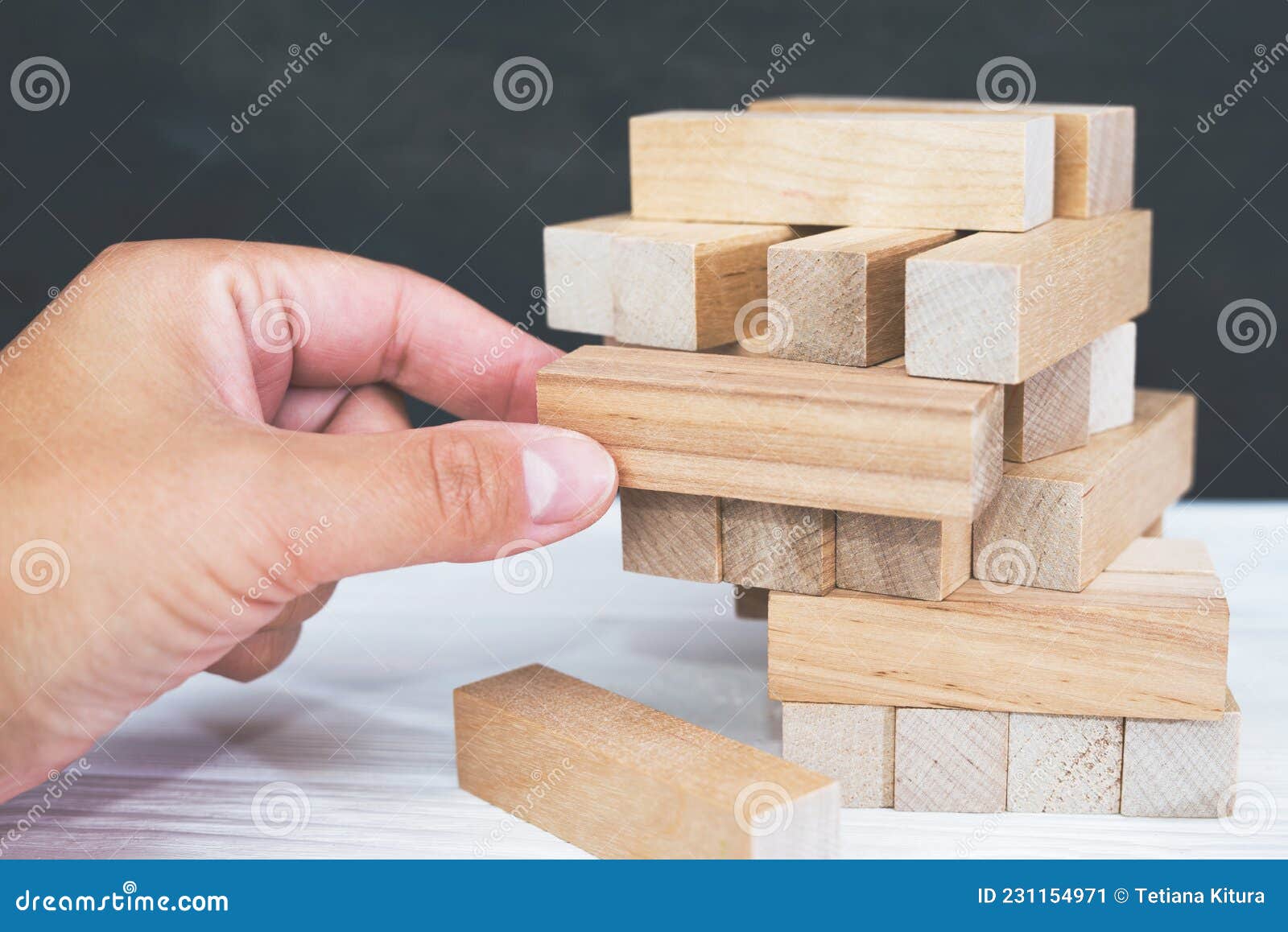 Made of Wooden Blocks and Human Hands Take One Block Stock Image ...