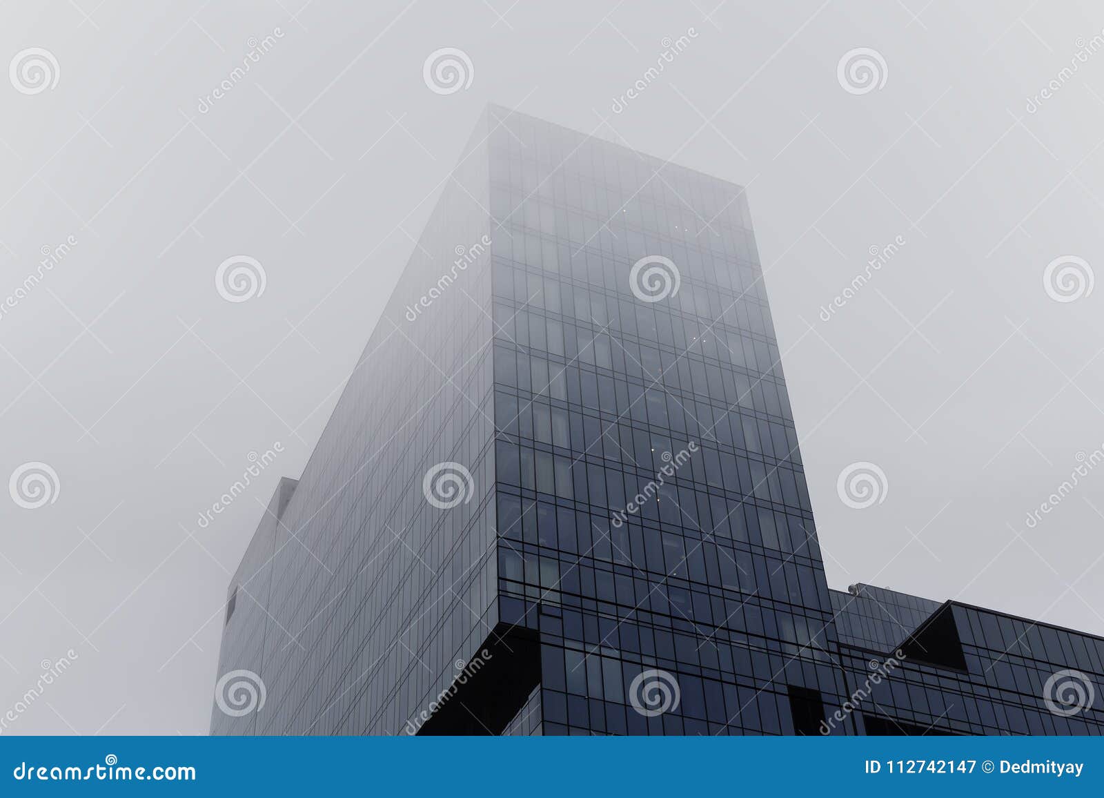 Tower of Modern Skyscraper Glass Building in Fog or Mist Stock Image ...