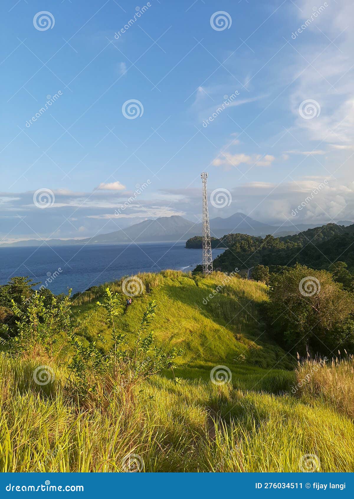 A Tower on a Mountain Full of Grass Stock Image - Image of grass, tower ...