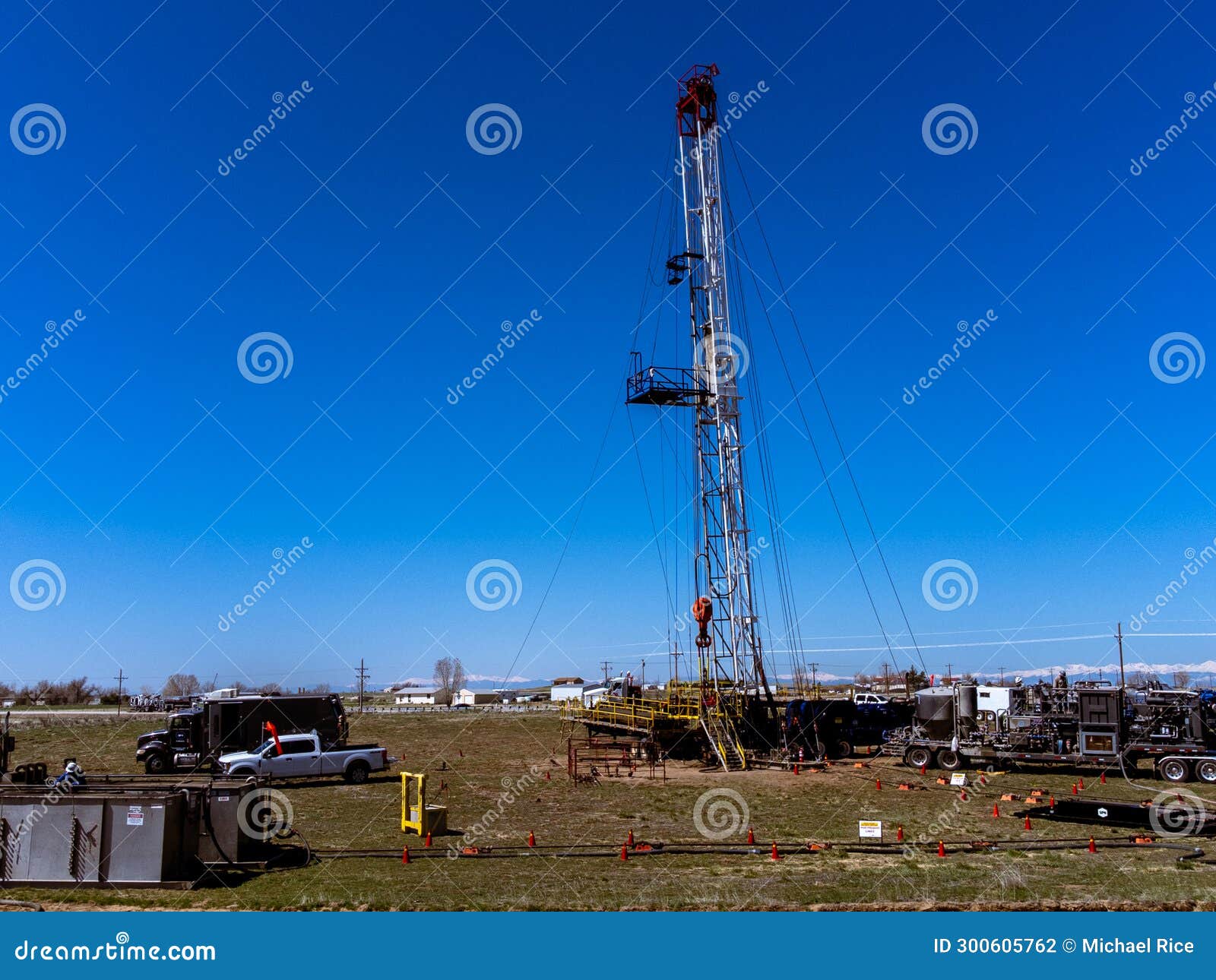 Tower of Progress: Oil Rig Soaring High in a Brilliant Blue Sky Stock ...