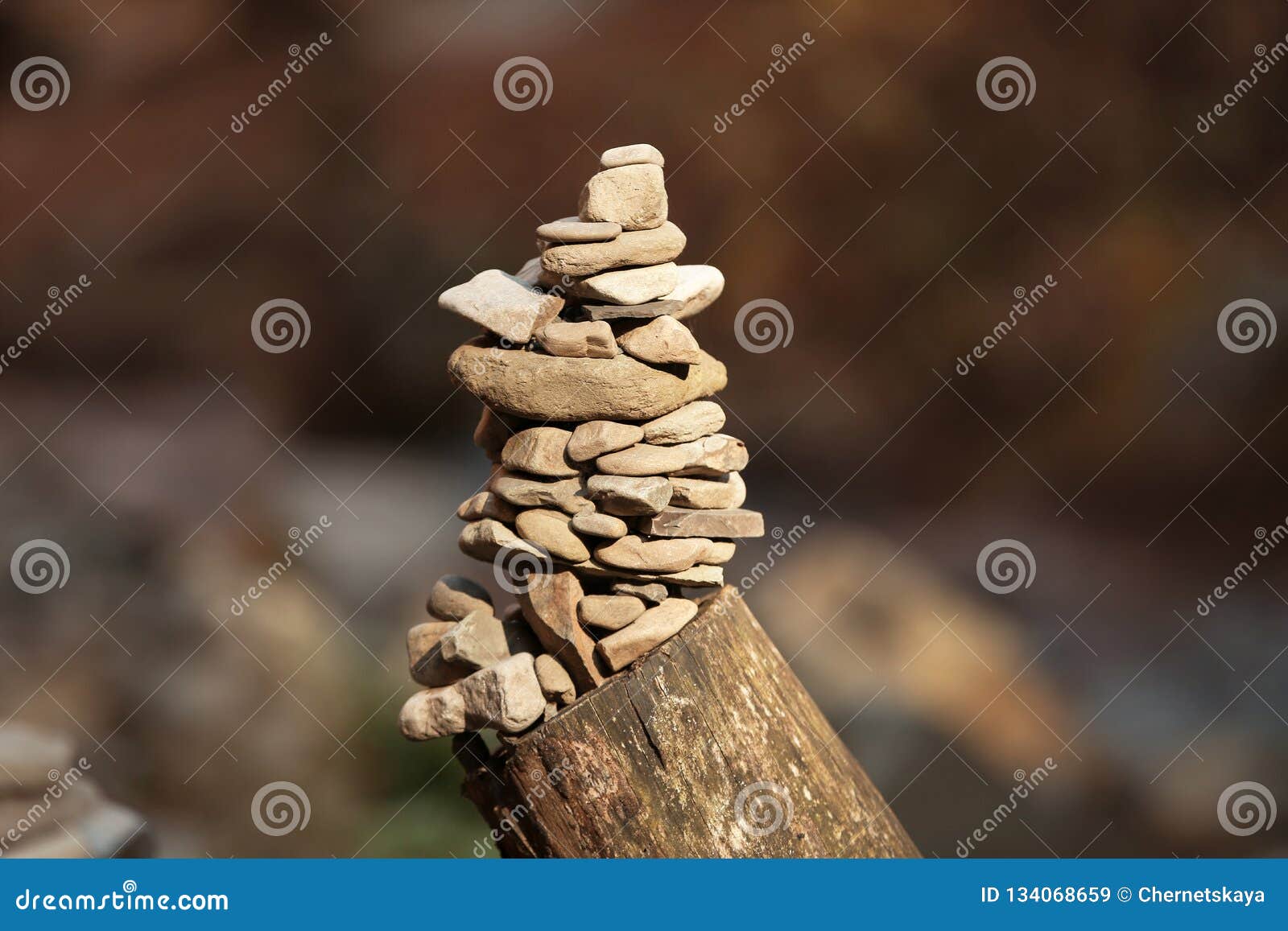 Tower of Stones on Tree Stump in Forest Stock Image - Image of ...