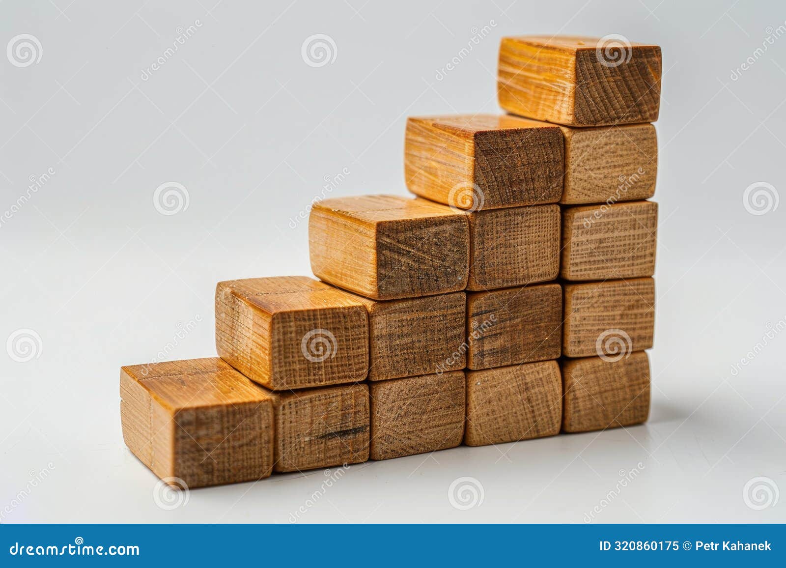 A Tower Of Wooden Blocks Symbolizing Success Built Step By Step ...