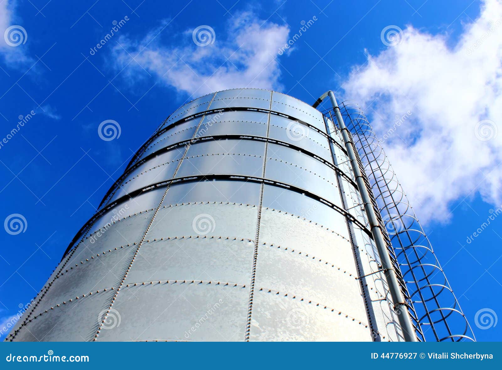 Towering Grain Silo Under Blue Skies. Stock Image - Image of ...