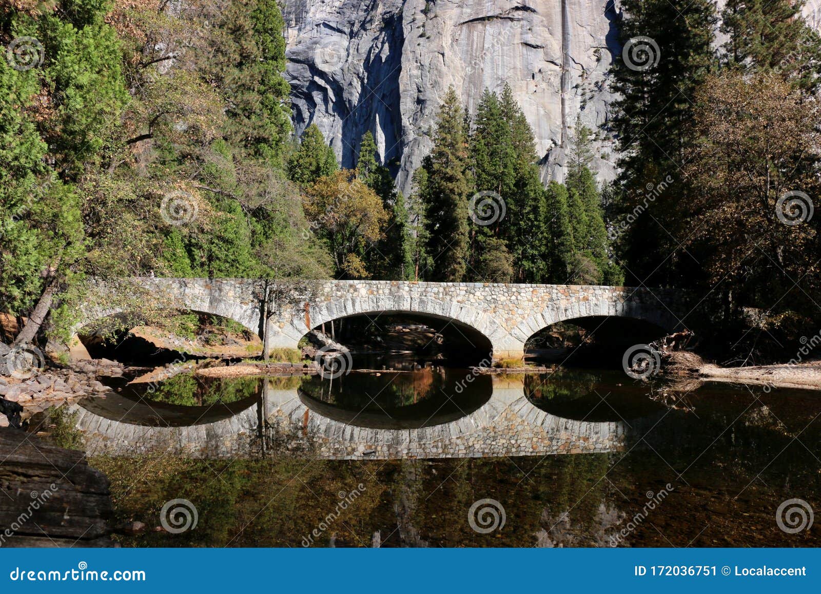 An Old Stone Bridge is Reflected in the Merced River, Yosemite National ...
