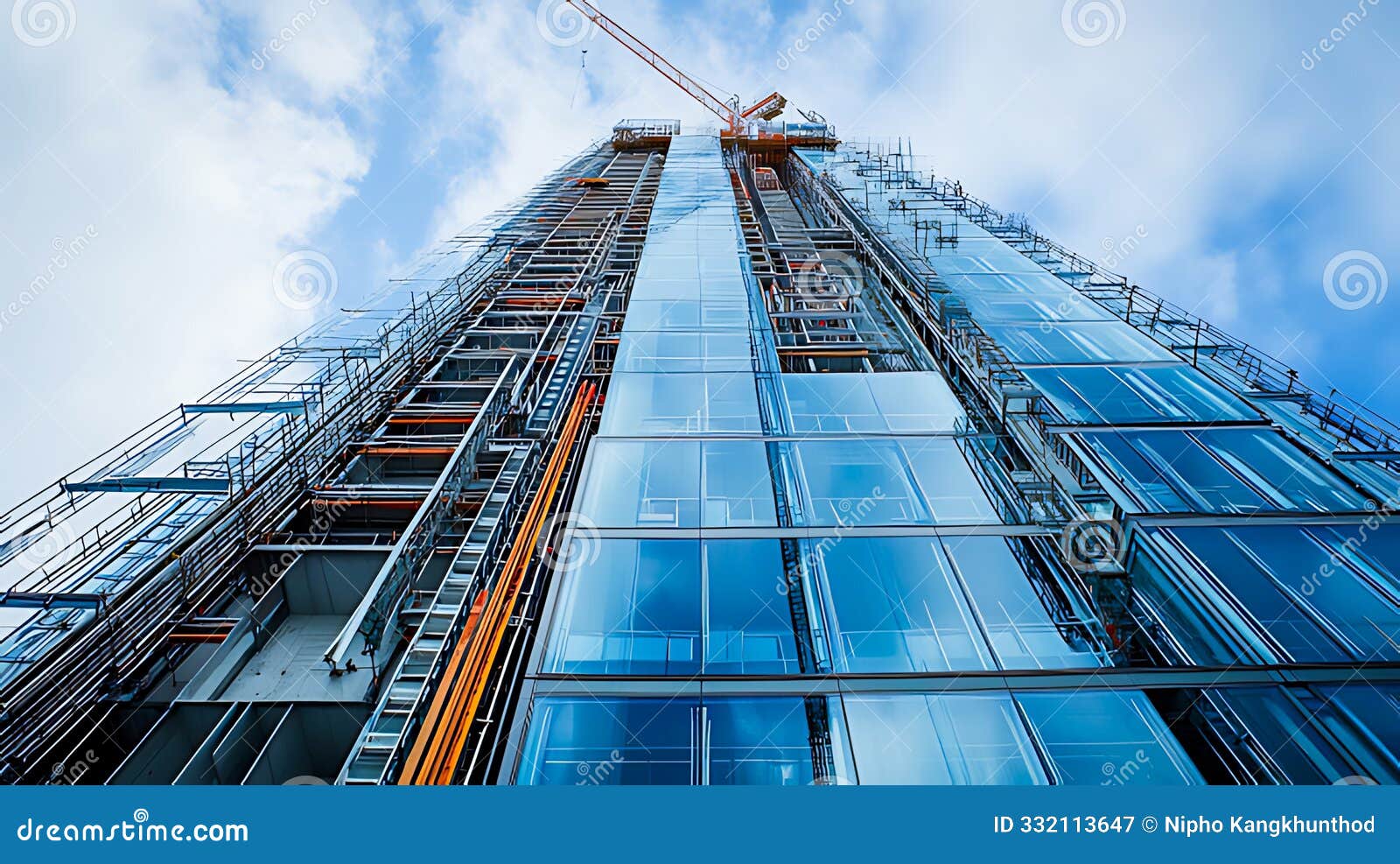 A Tall, Modern Building is Being Constructed with Glass Panels and ...