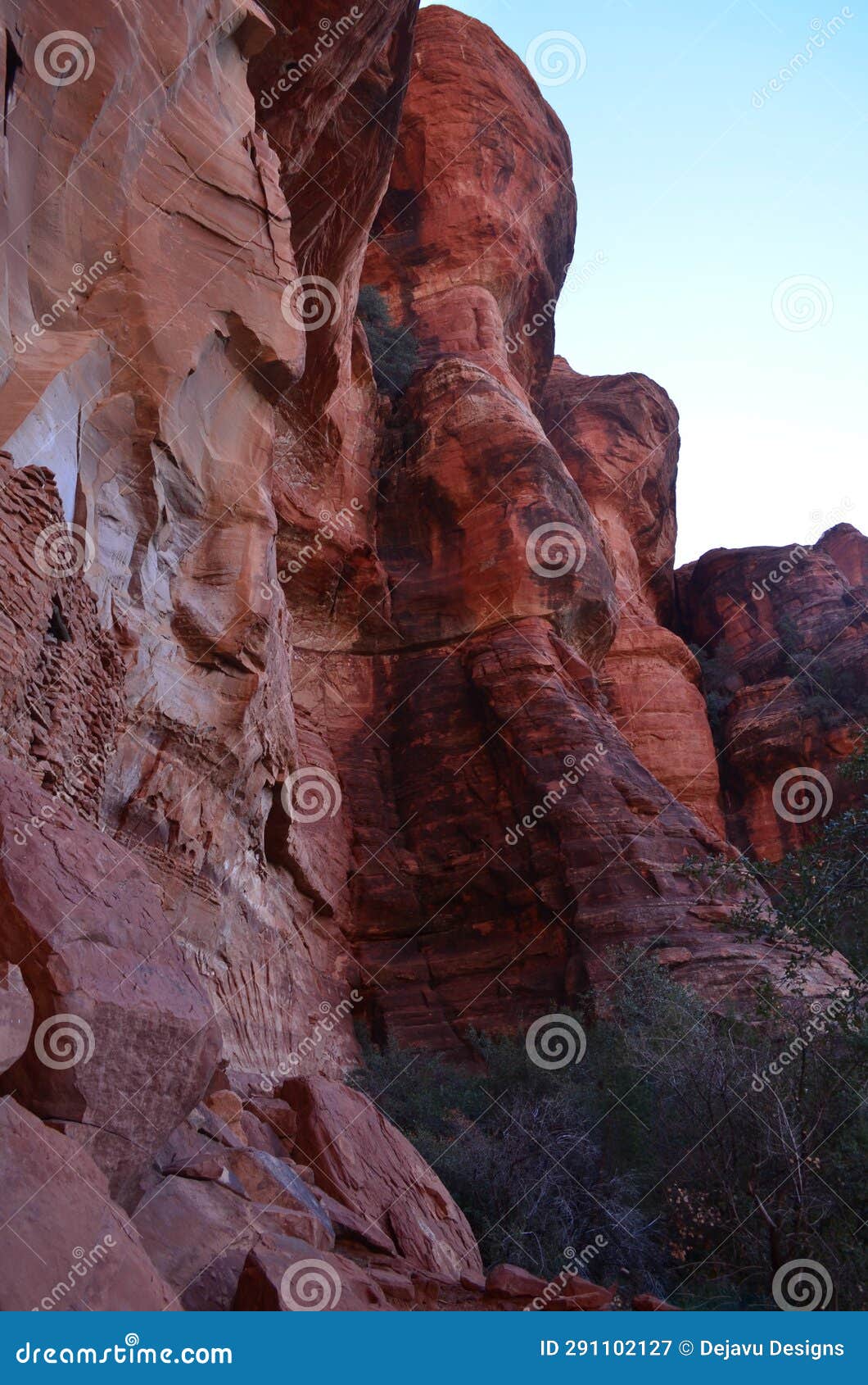 Towering Red Rock Cliffs the Foundation for Cliff Dwellings Stock Image ...