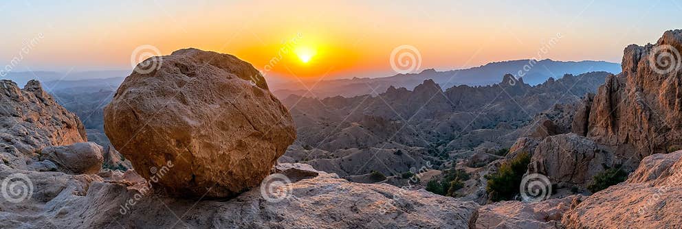 A Towering Stack of Rocks, Crowned by a Massive Boulder, Overlooks the ...