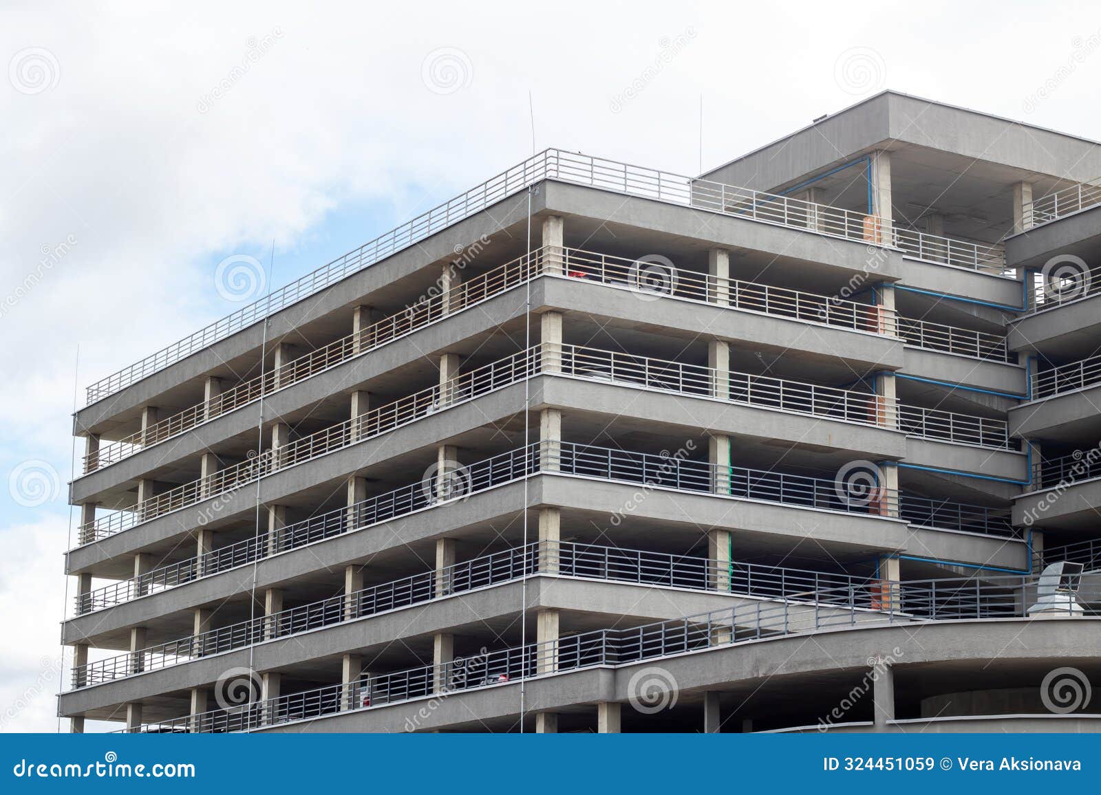 A Towering Structure with Ample Parking Spots Near it Stock Image ...