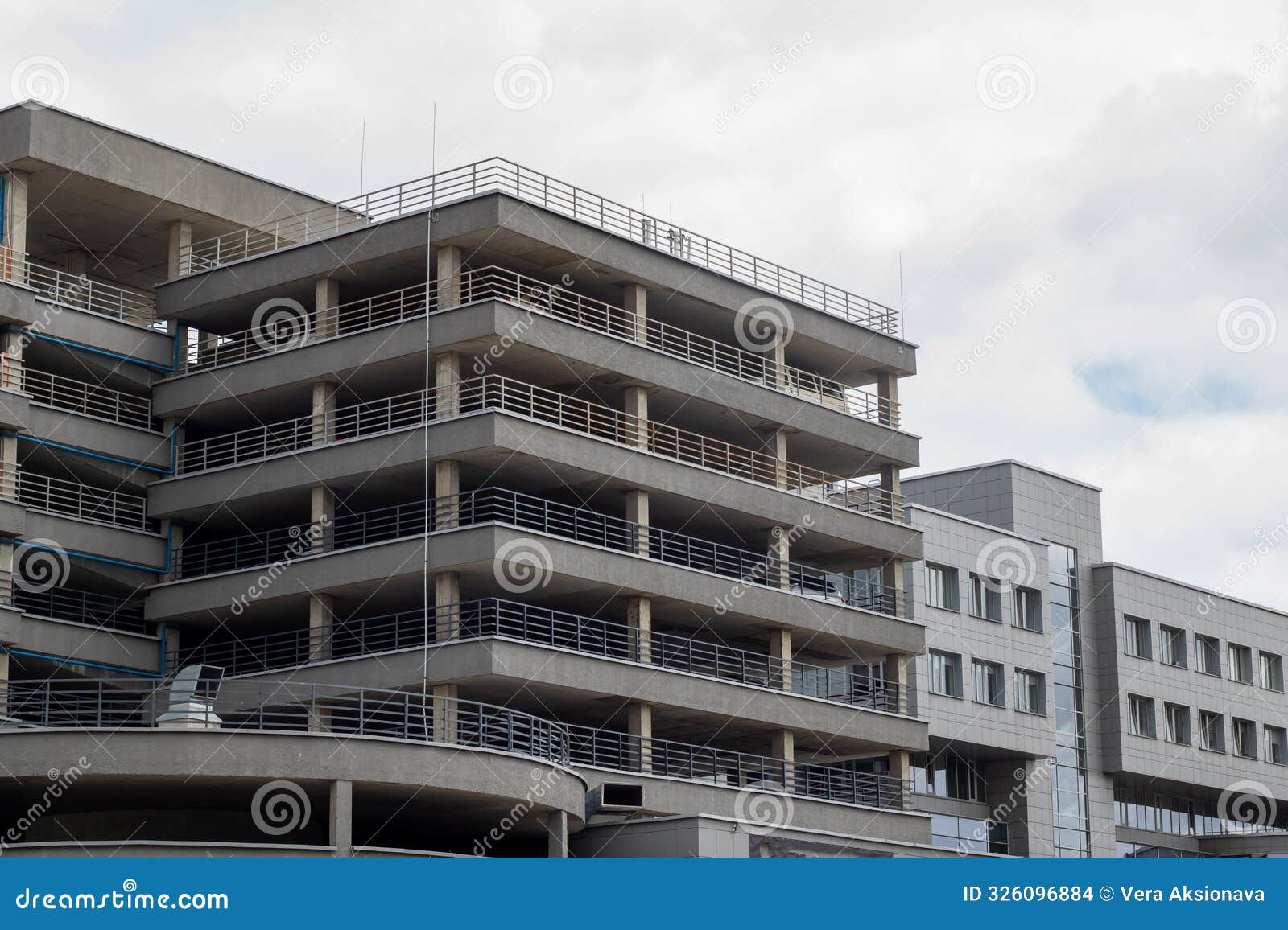 A Towering Structure with Ample Parking Spots Near it Stock Photo ...
