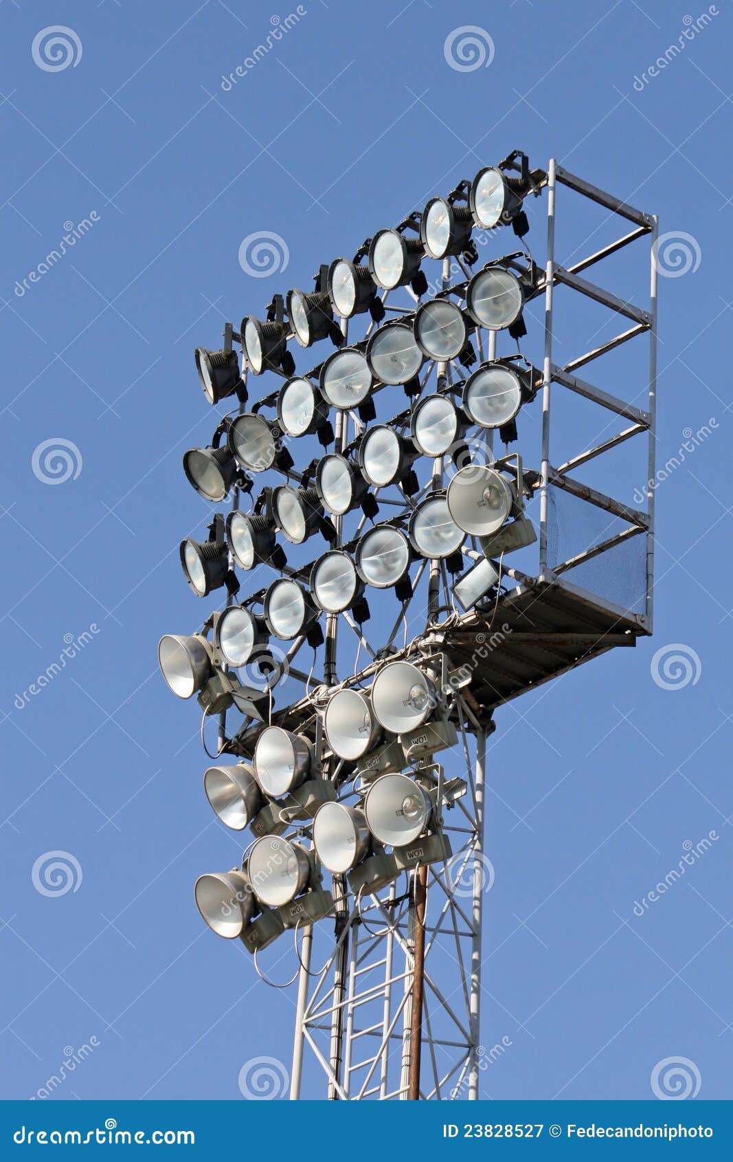 Towers with spotlights stock image. Image of lights, industrial - 23828527