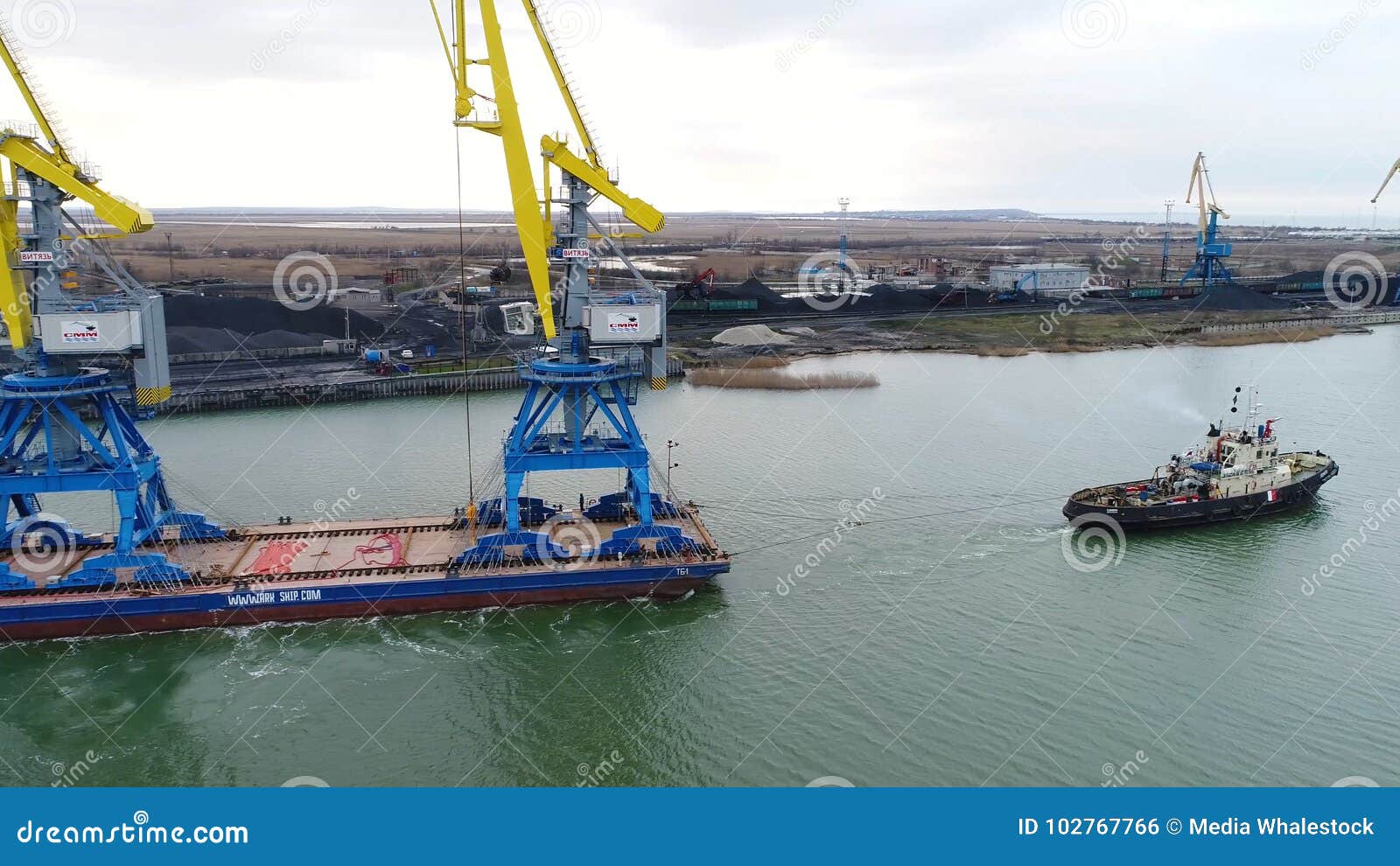 Towing Cranes for Containers. Large Container Ship Pulled by Tugboats ...