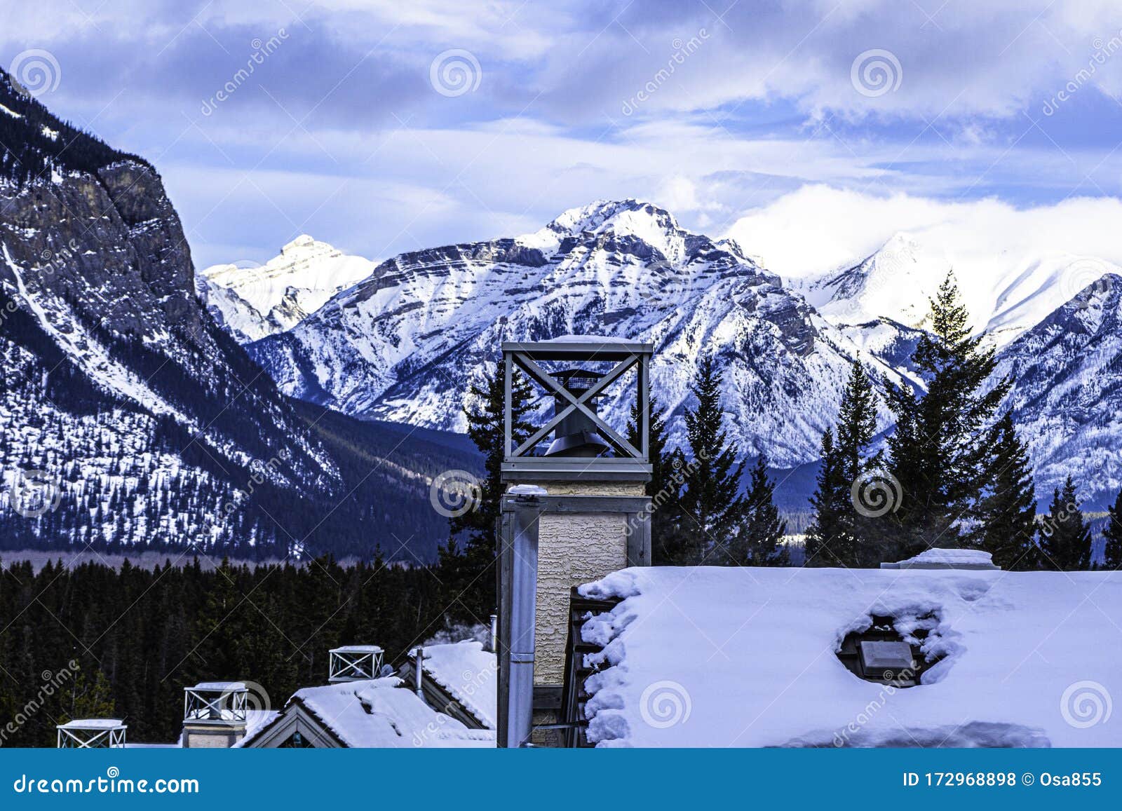 Town Rooftops in Front of Mountain Ranges Stock Photo - Image of banff ...