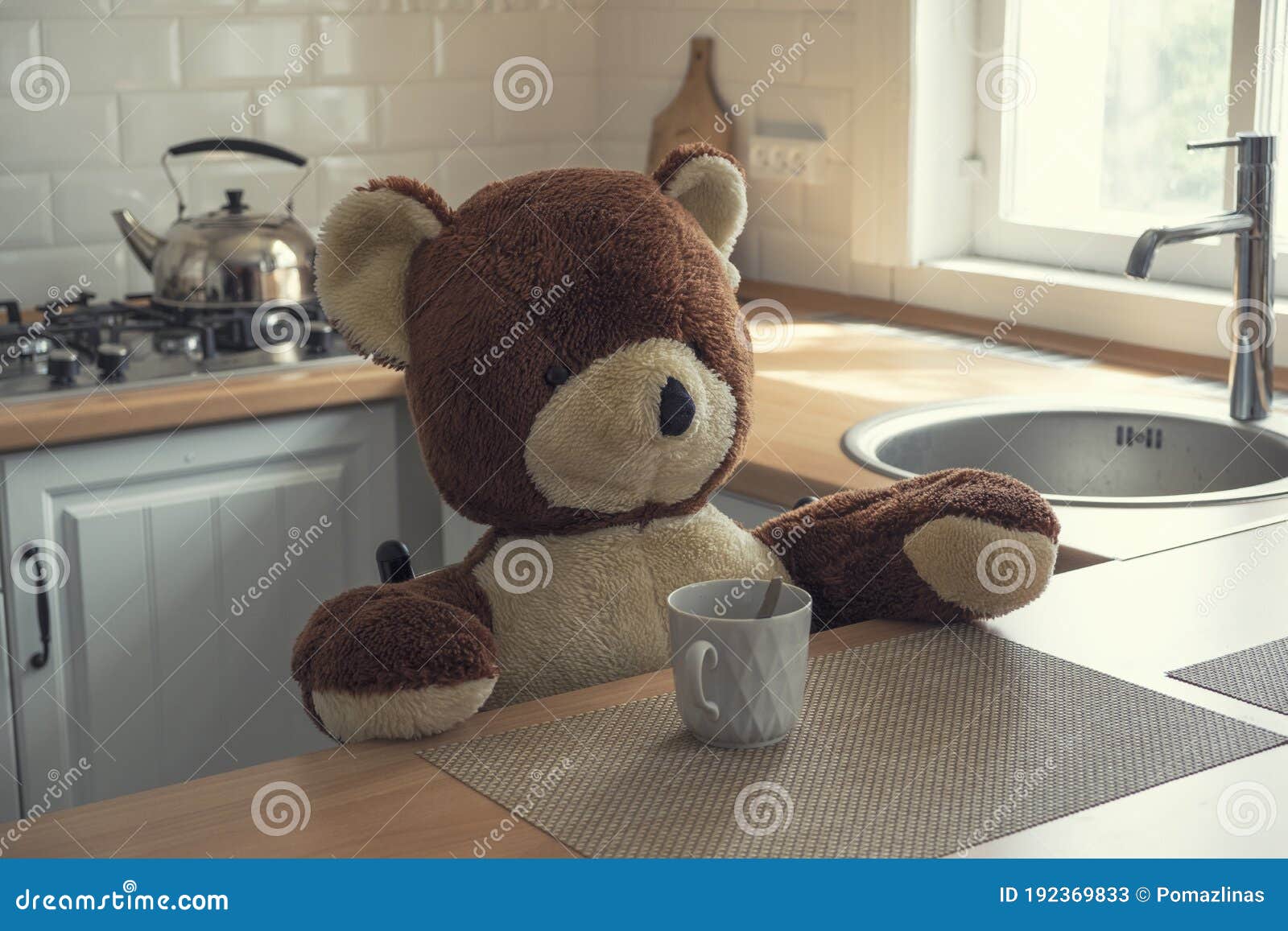 Toy Bear Sits at a Table in a Bright Modern Kitchen Stock Image - Image ...