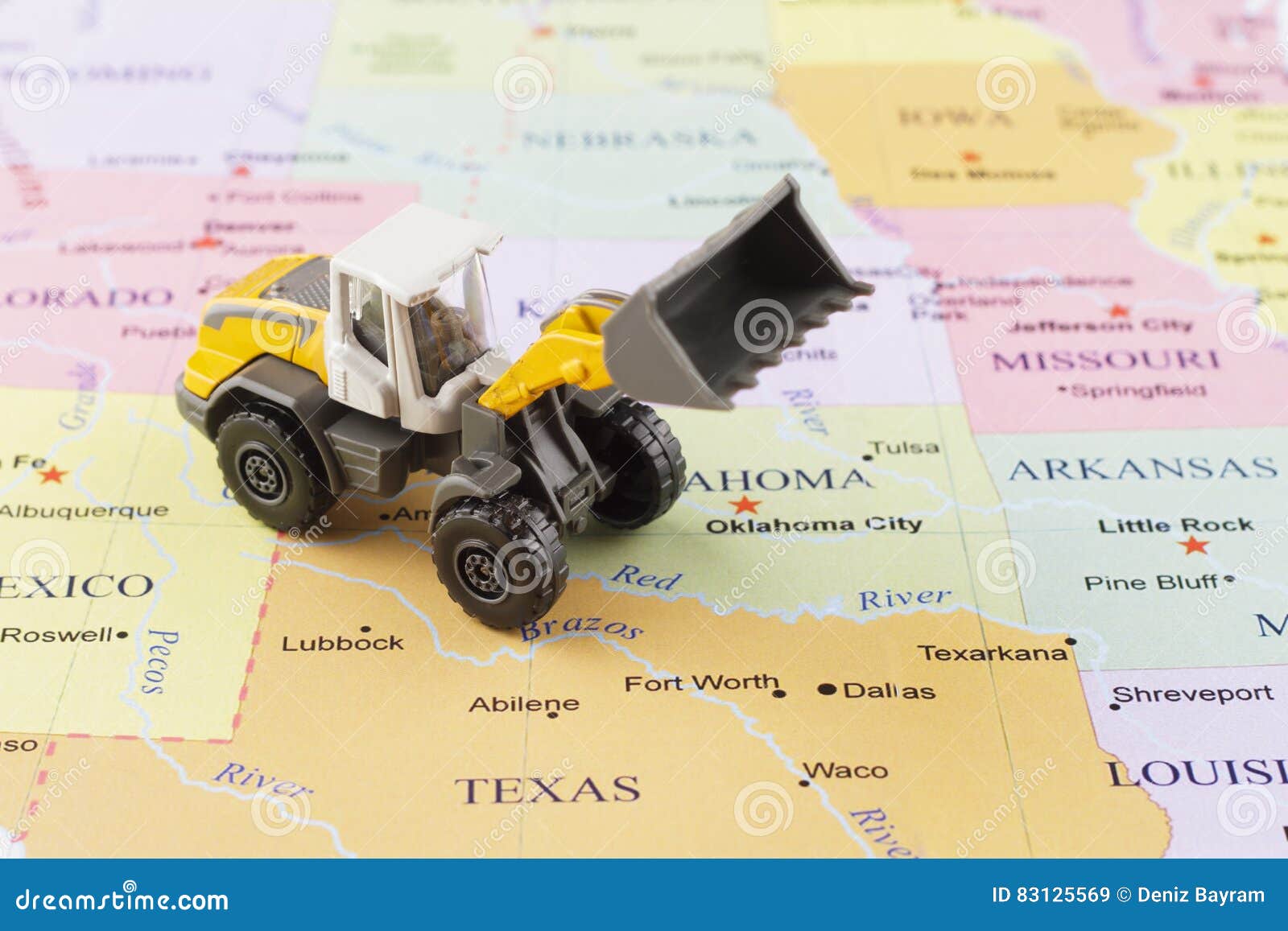 Toy Bulldozer Over the American Map Stock Image - Image of driving ...