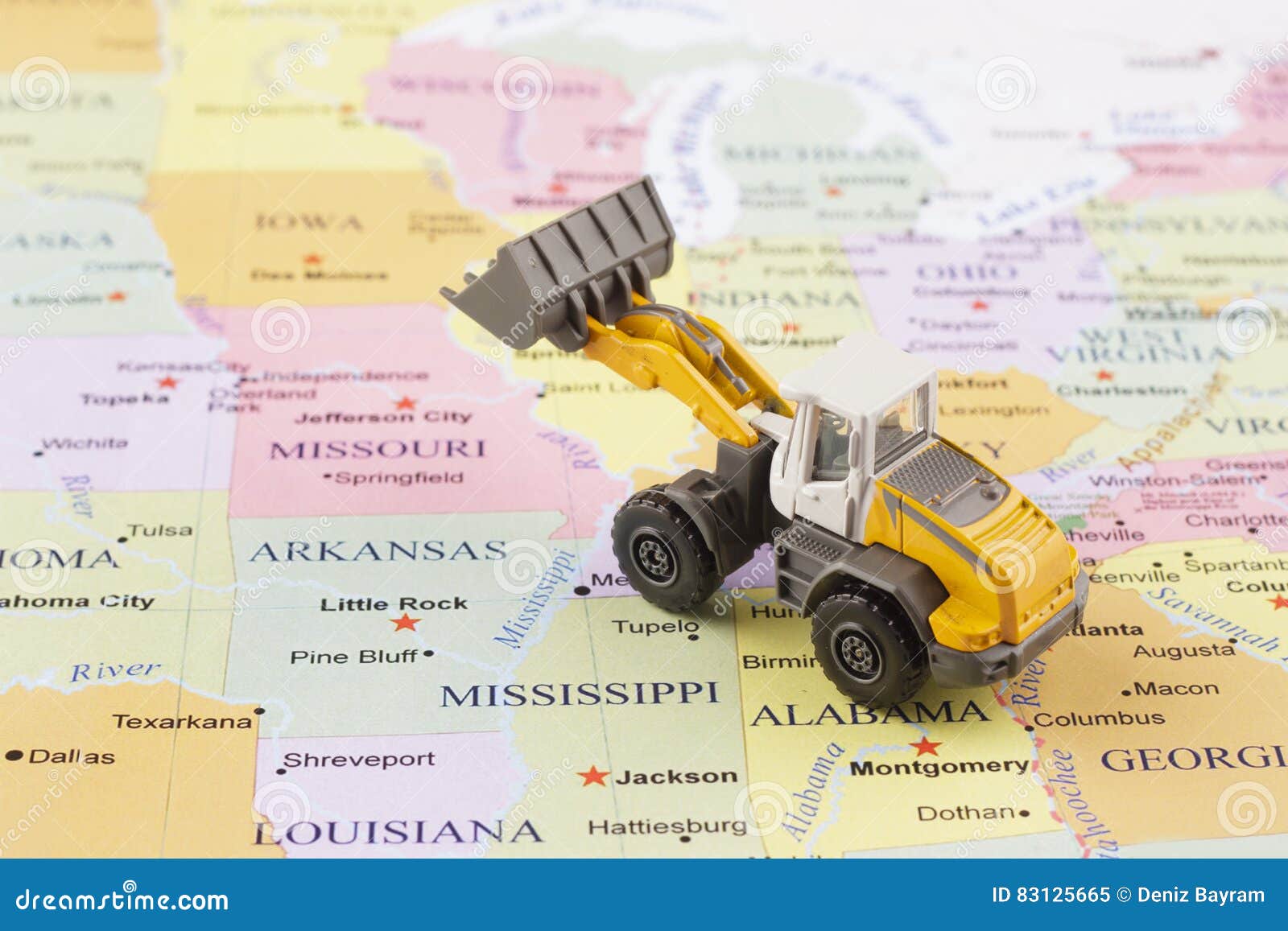 Toy Bulldozer Over the American Map Stock Image - Image of driving ...