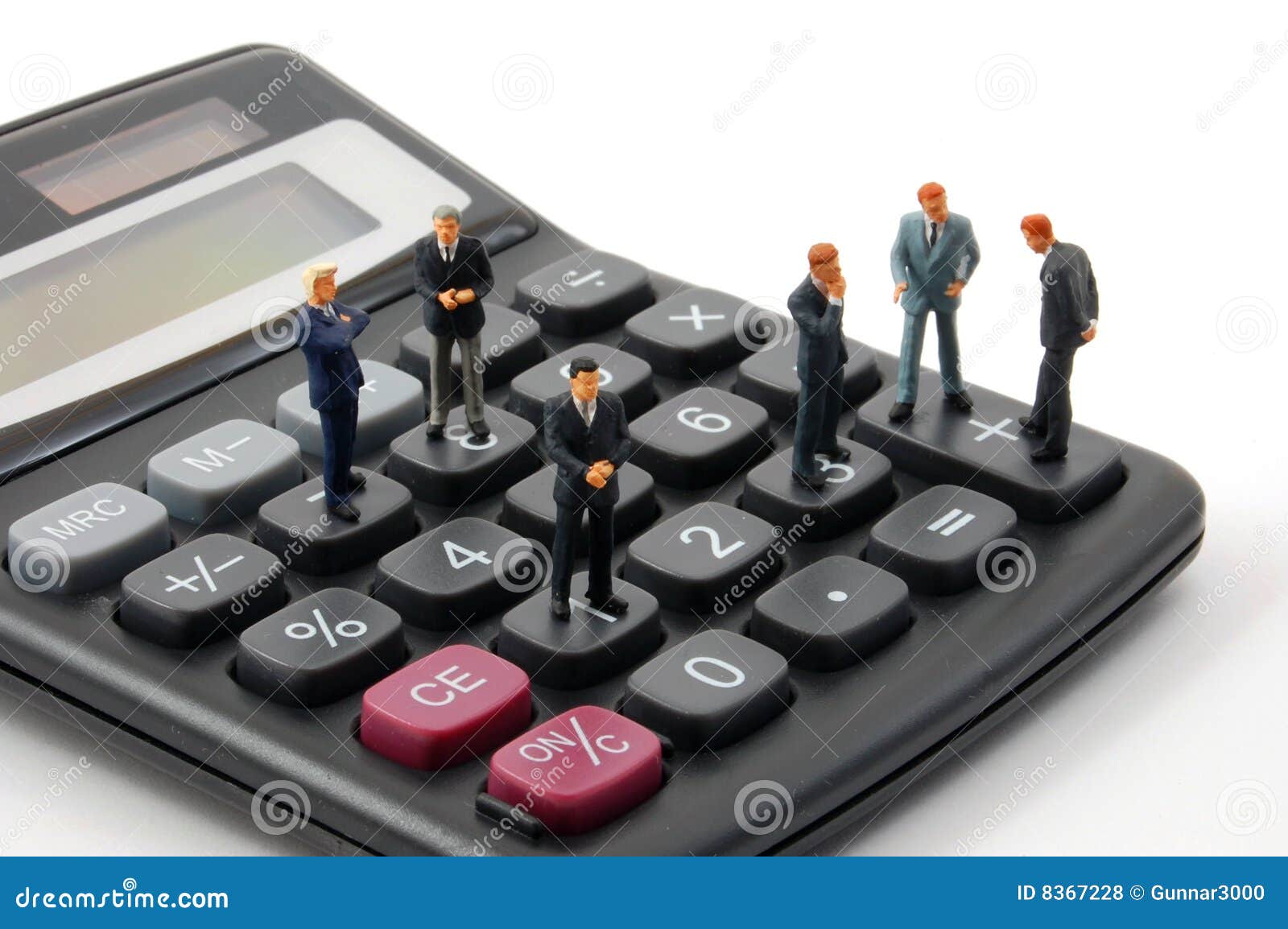 Toy Business Man on Calculator Isolated Stock Photo - Image of economic ...
