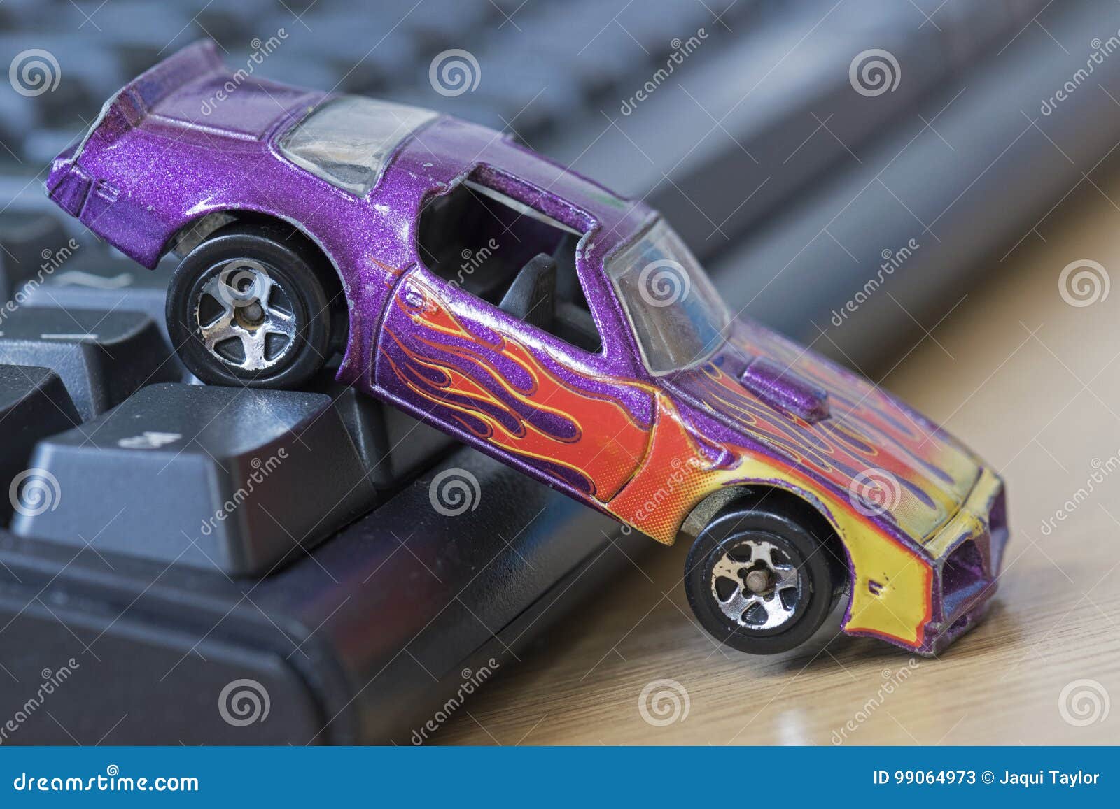 Toy car on a keyboard stock image. Image of work, purple - 99064973