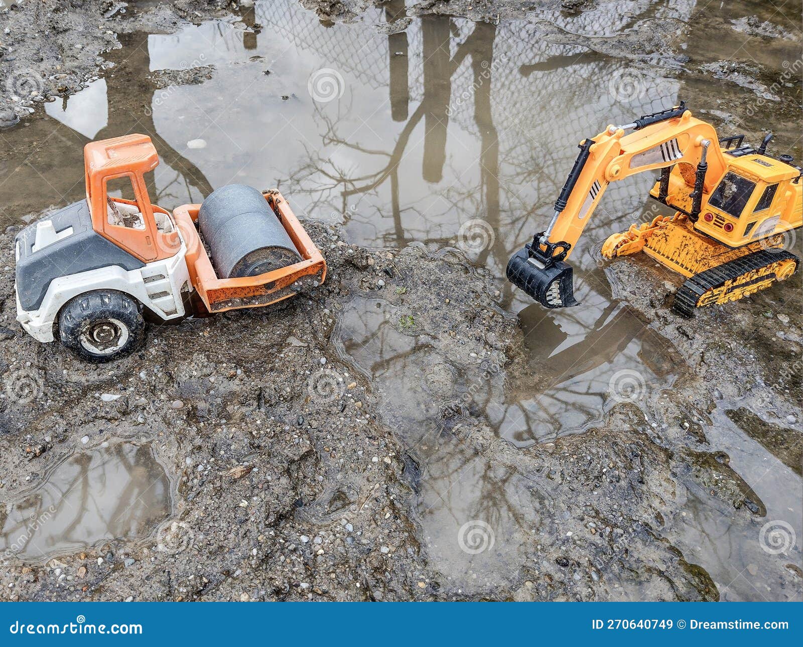 Toy Compactor and a Toy Excavator in the Mud Stock Image - Image of ...