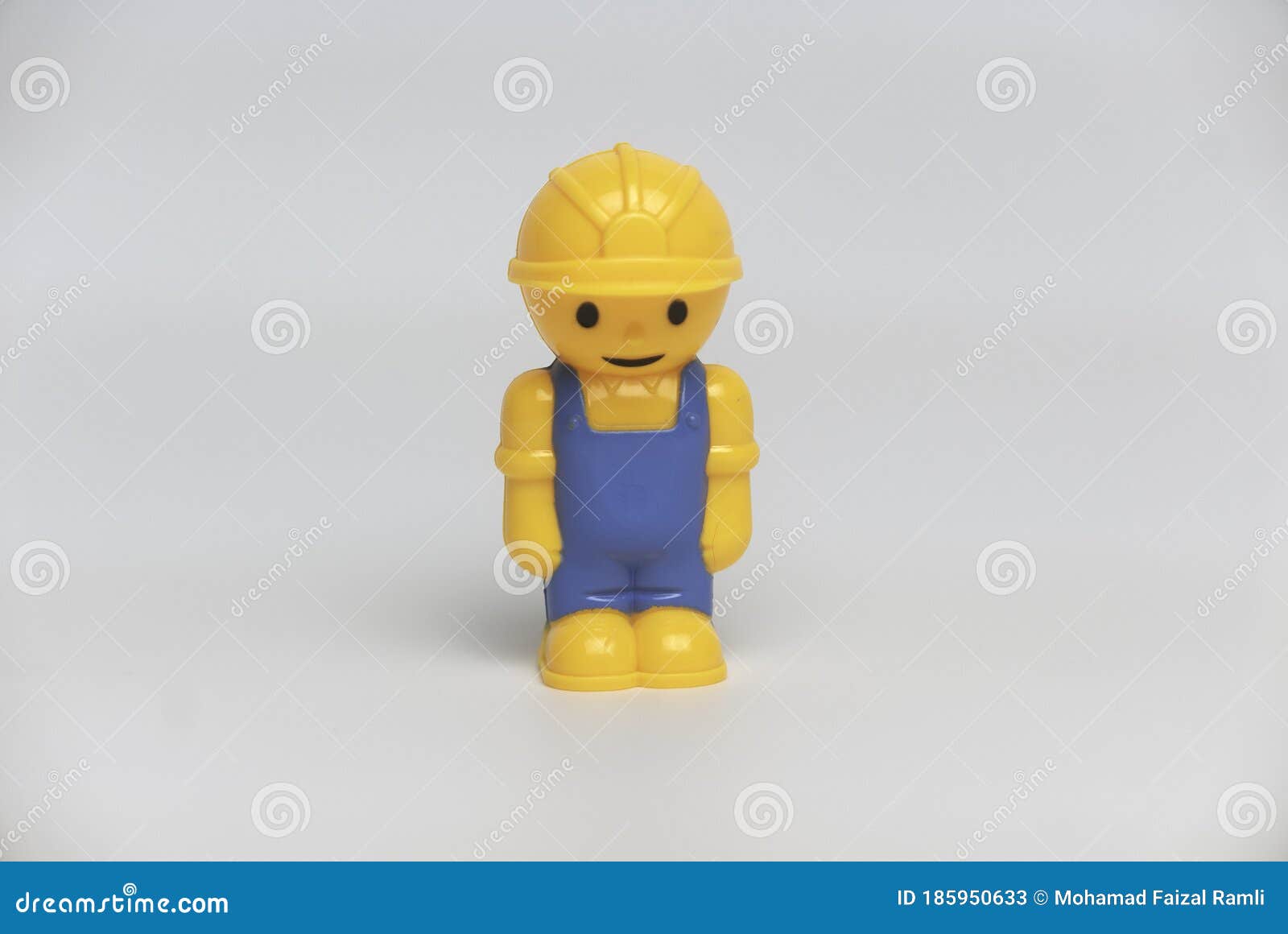 Toy of Construction Worker with Safety Helmet Isolated on White ...