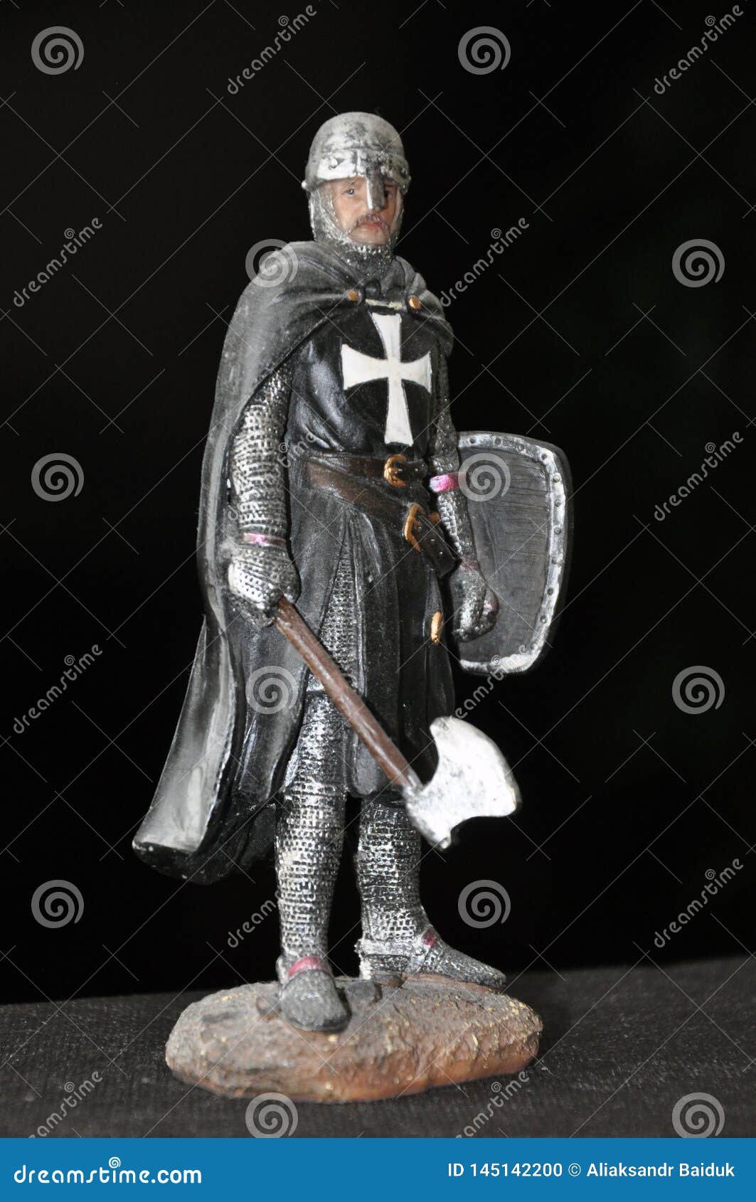 Toy Figure Knight with an Ax and a Shield on a Black Background Stock ...
