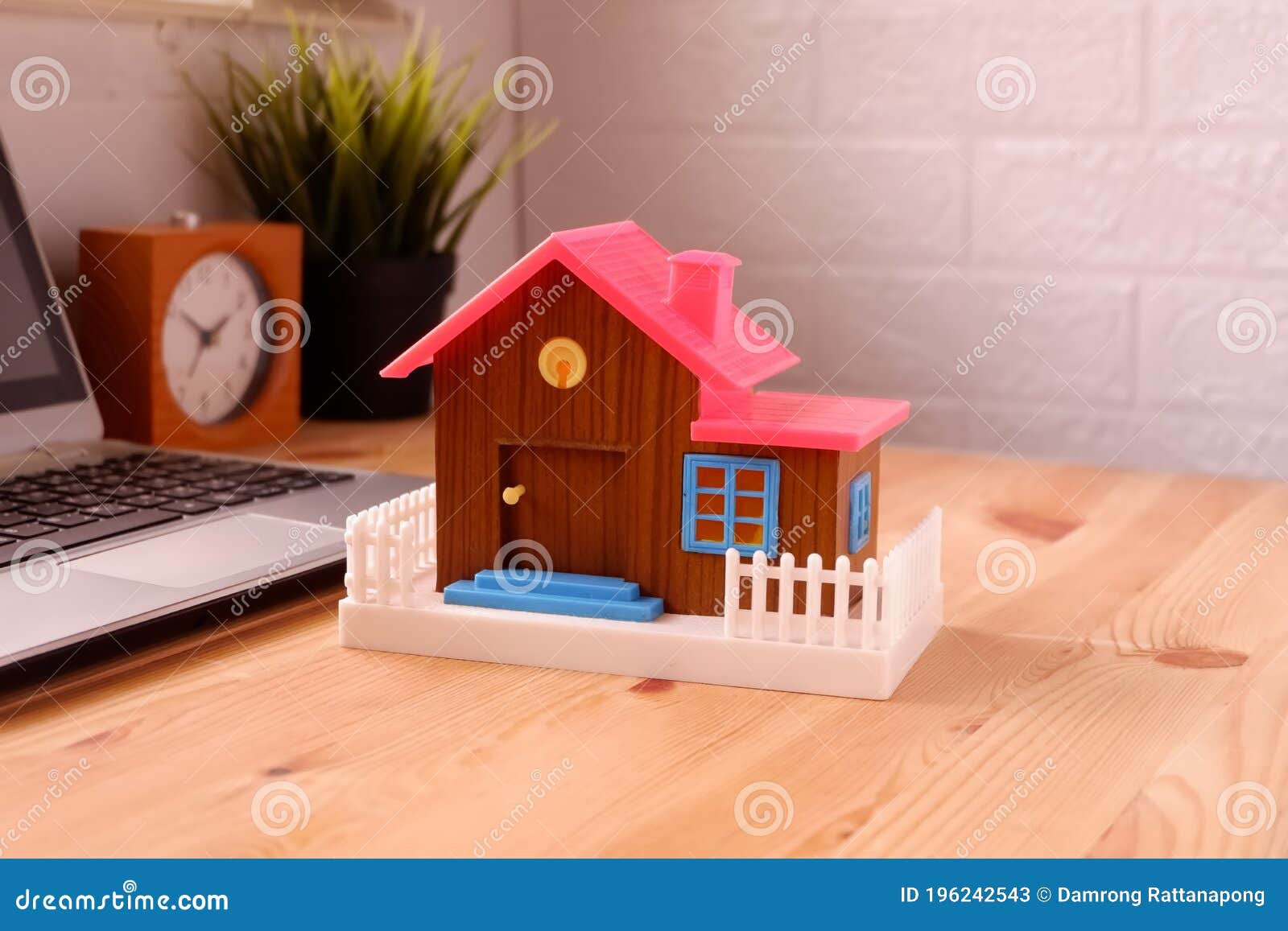 Toy House on Desk with Laptop Computer, the Concept of Buying a Dream ...