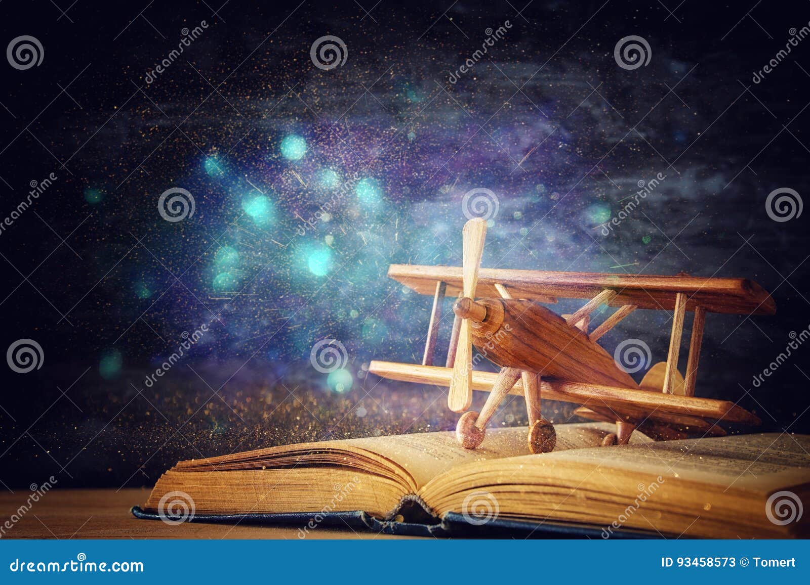 Toy Plane and the Open Book on Wooden Table. Stock Image - Image of ...