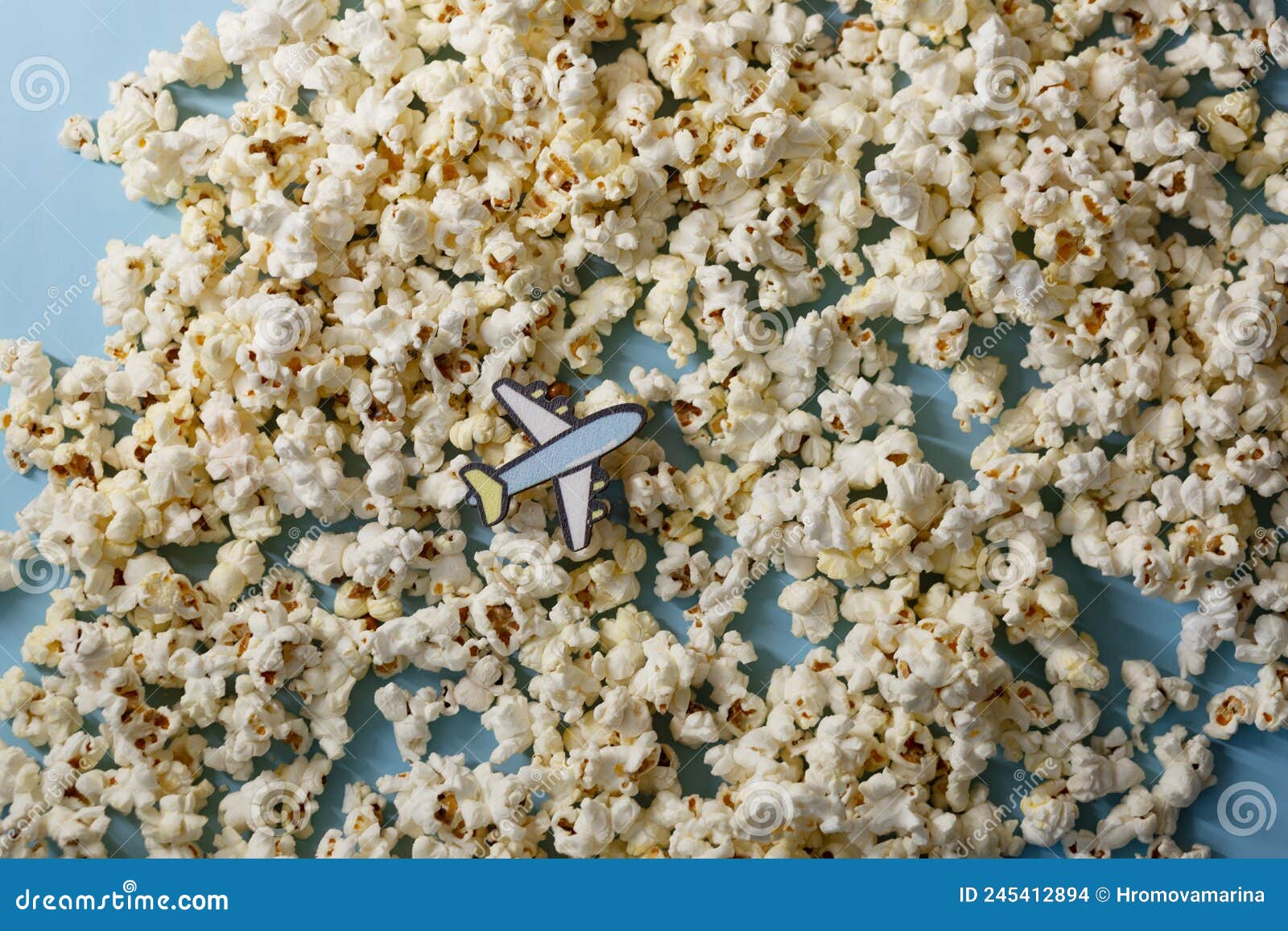 A Toy Plane Over Popcorn Clouds and Blue Sky Stock Photo - Image of ...