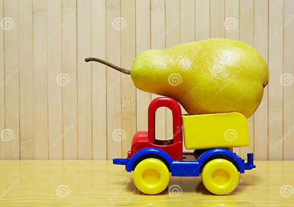 Toy plastic car with pear stock photo. Image of green - 79173356