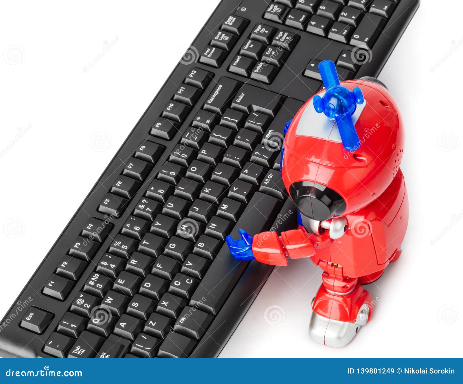 Toy robot and computer stock image. Image of engineering - 139801249
