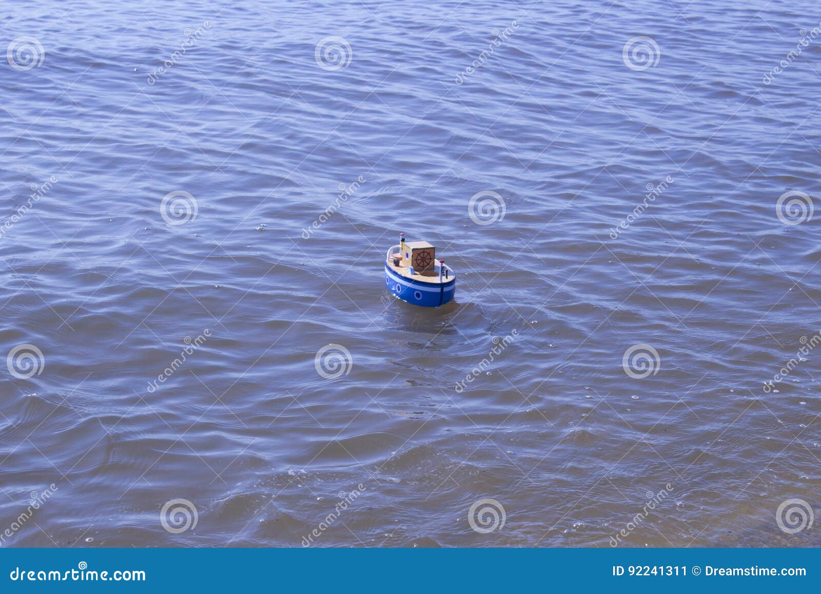 Toy ship floats in water. stock image. Image of travel - 92241311