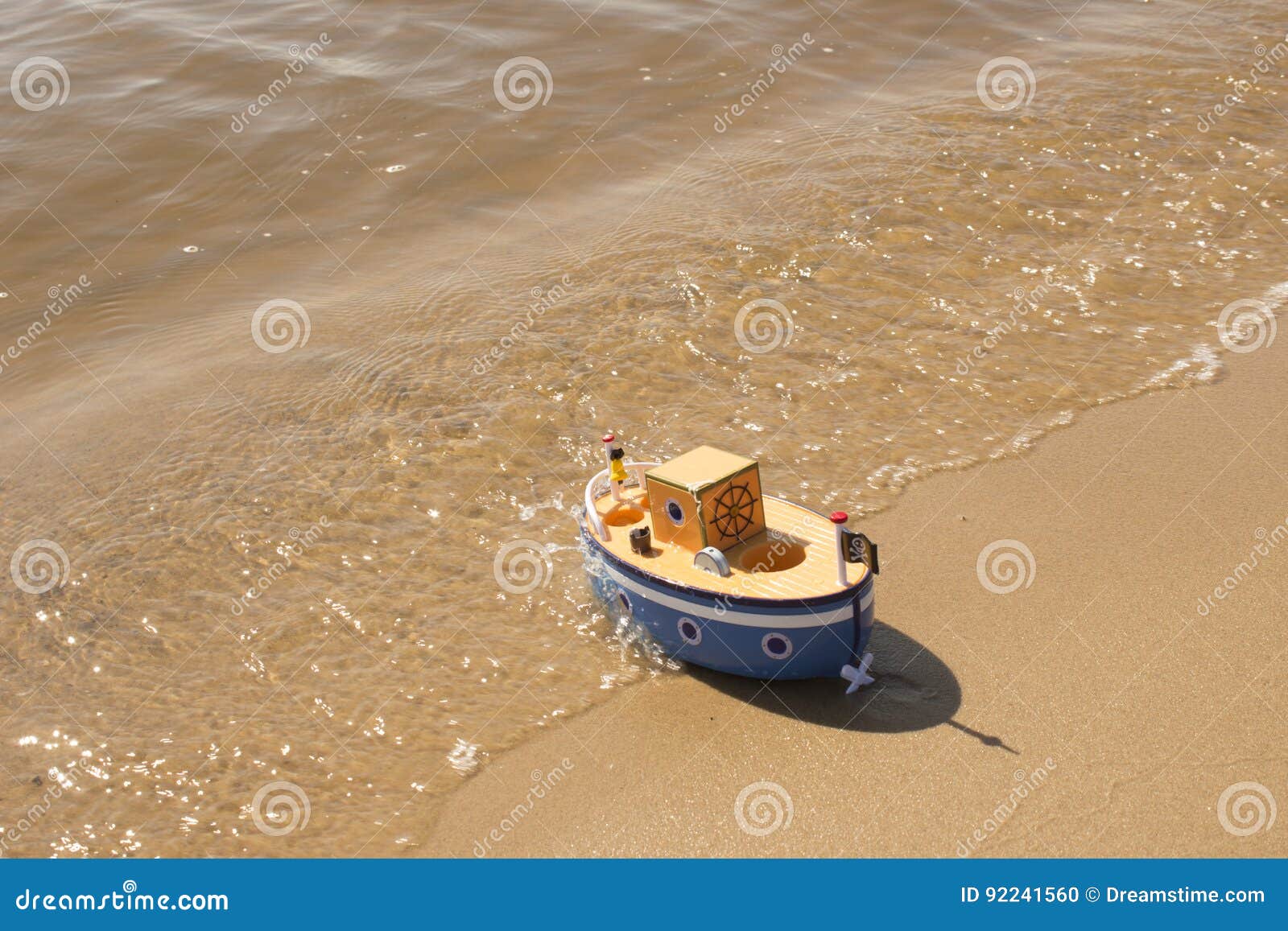 Toy ship floats in water. stock photo. Image of july - 92241560
