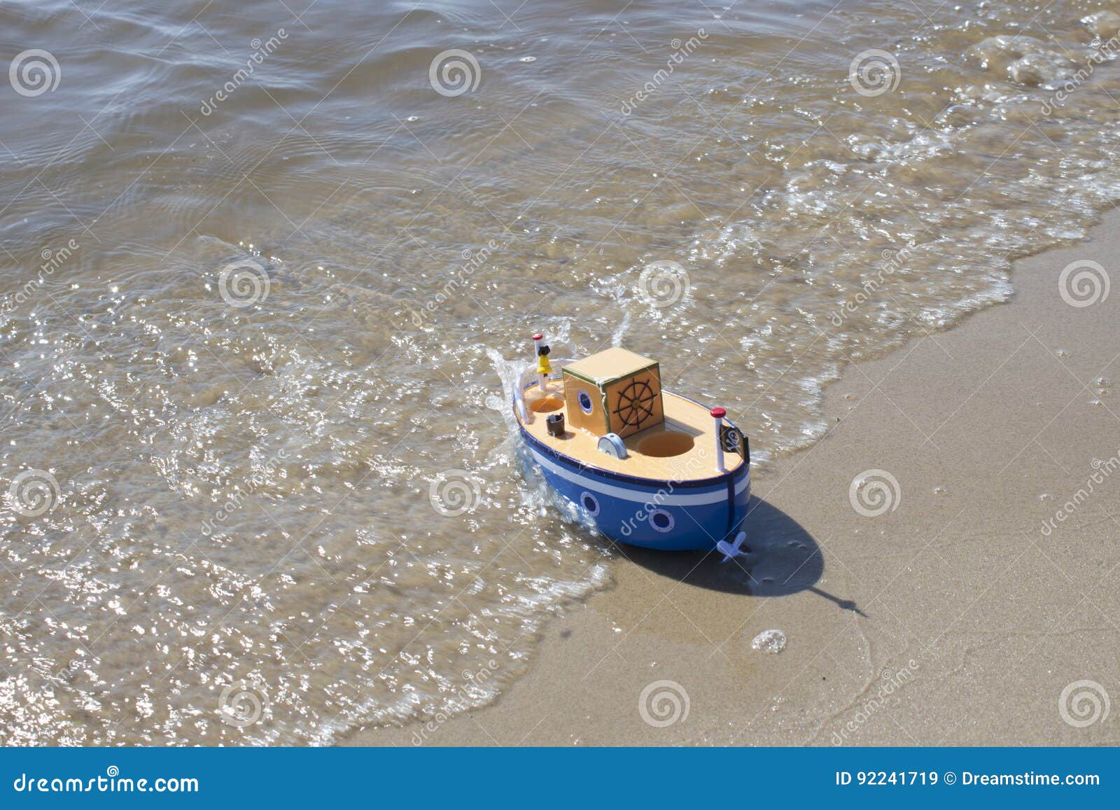 Toy ship floats in water. stock image. Image of sailboat - 92241719