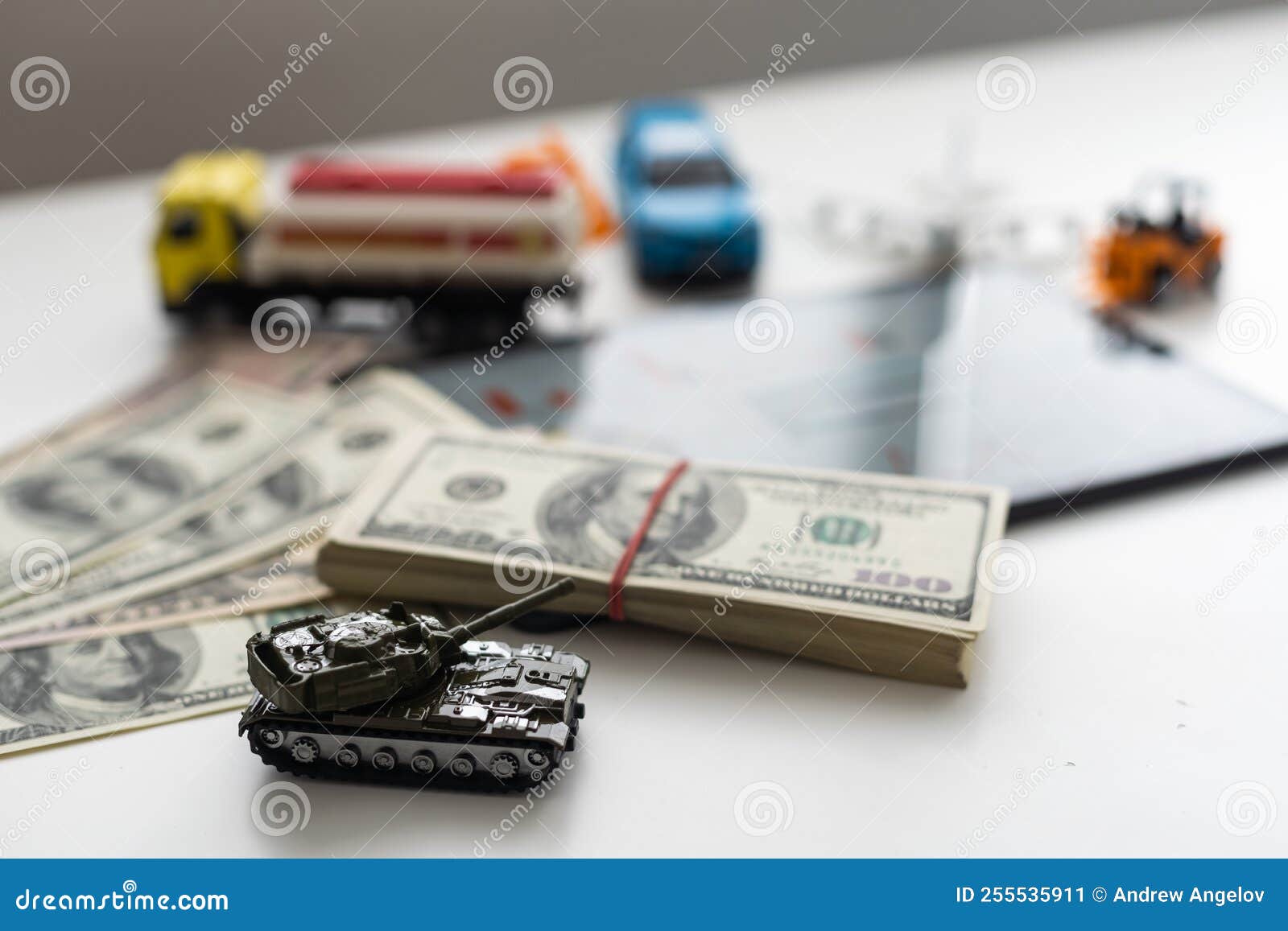 A Toy Tank, Dollars and a Tablet Stock Image - Image of plastic ...