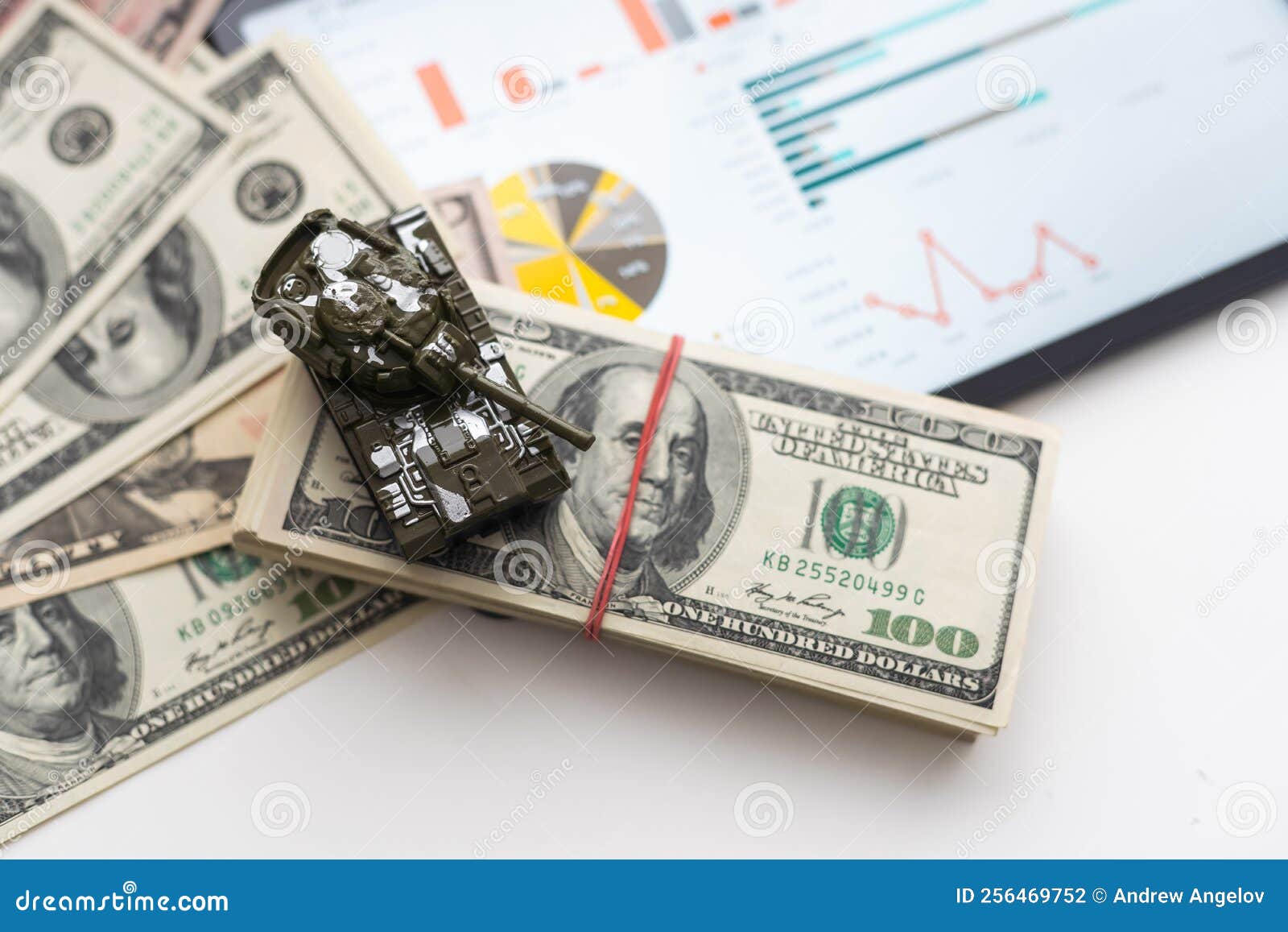 A Toy Tank, Dollars and a Tablet Stock Photo - Image of business ...