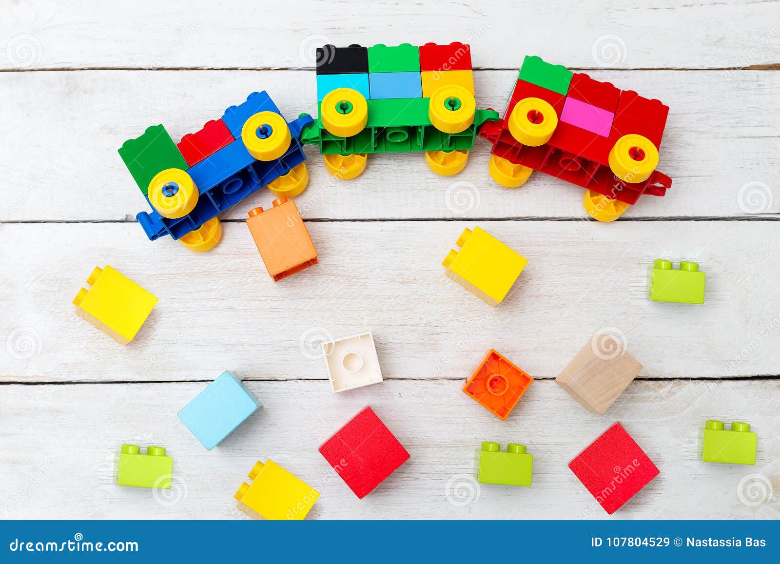 A Toy Train of Cubes of Lego on a Wooden Background. Early Learn Stock ...
