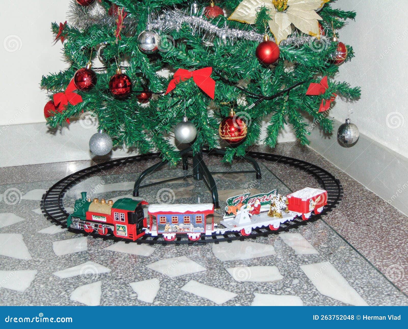 Toy Train Placed Under a Christmas Tree Stock Photo - Image of playing ...